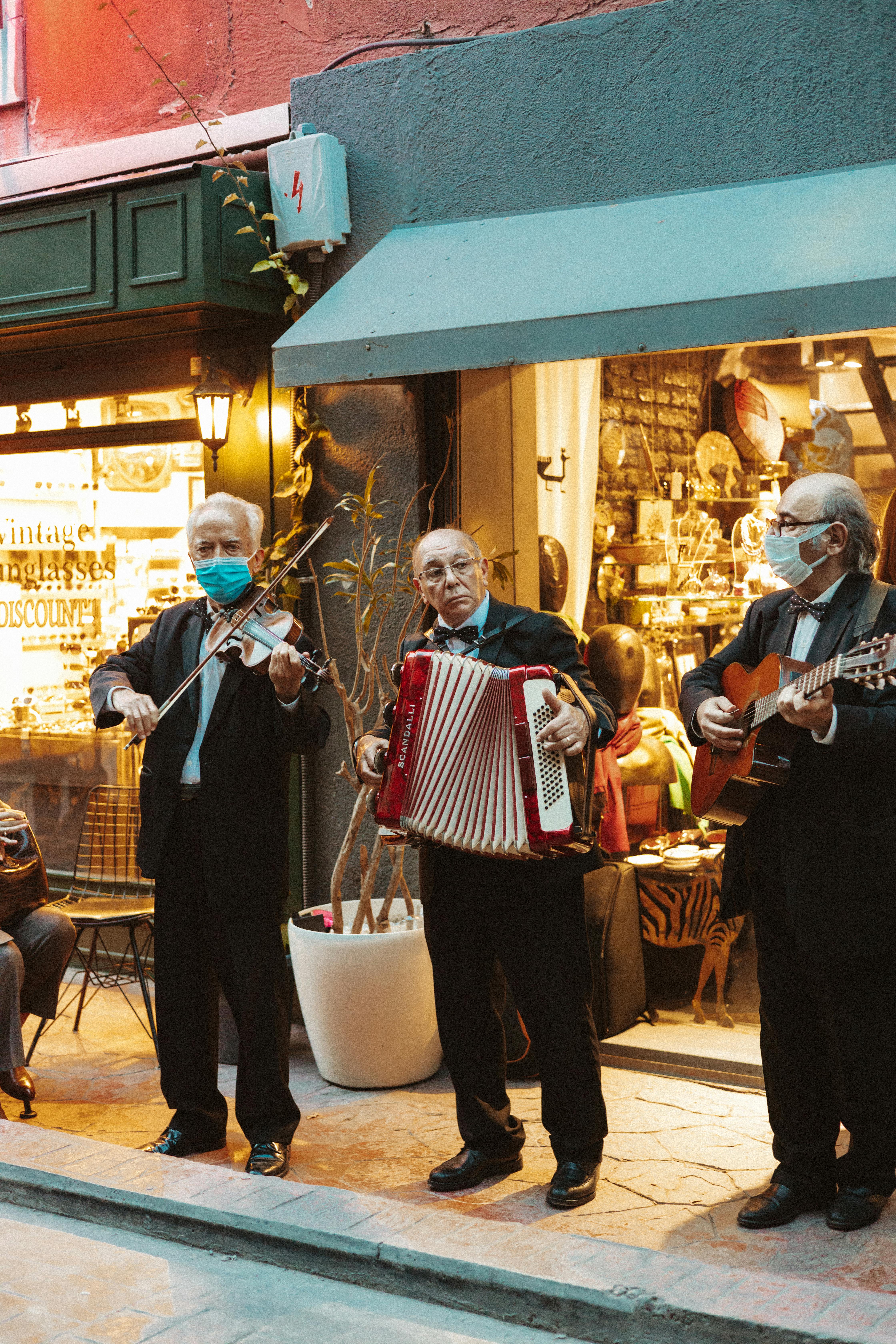 Elderly Men Playing Musical Instruments in Front of a Shop · Free Stock ...
