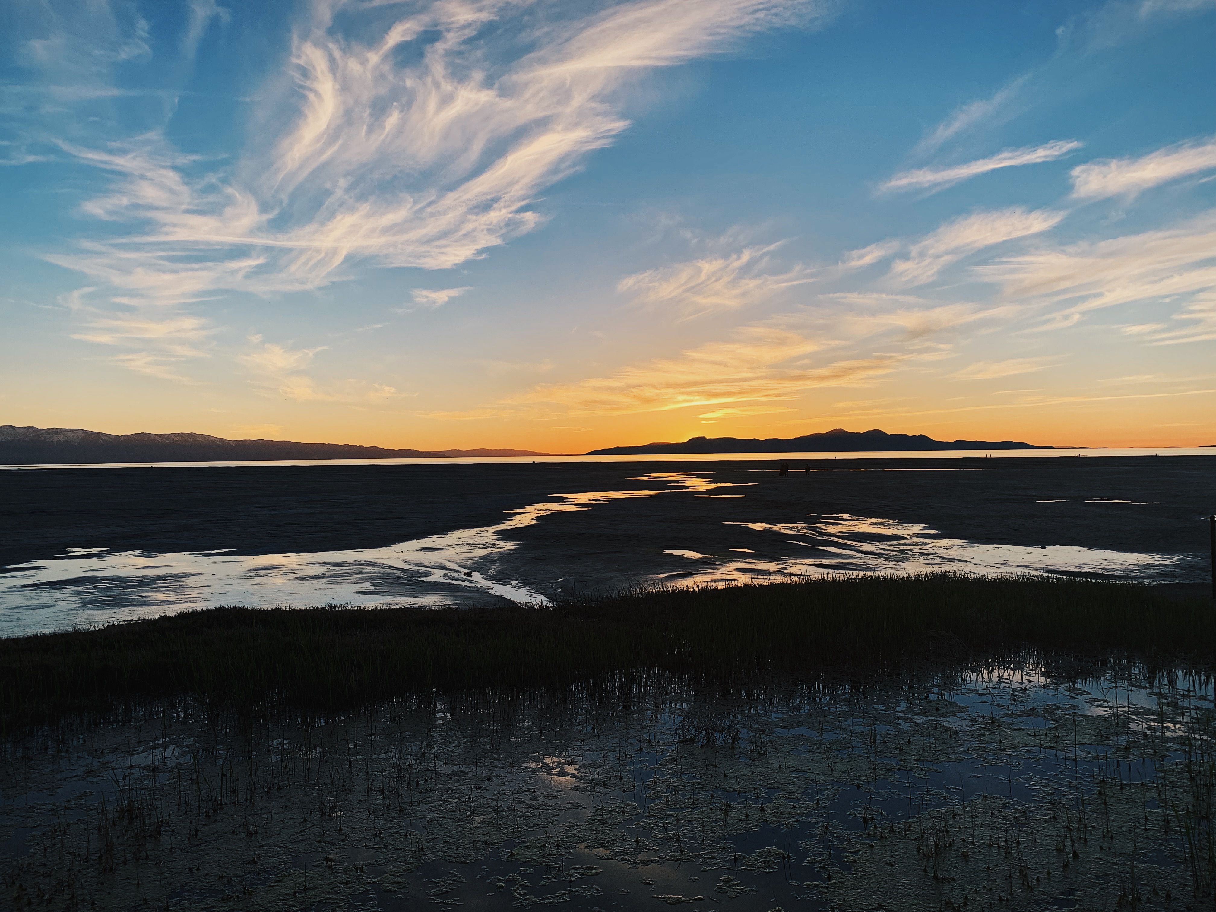 A Scenic Landscape with Body of Water at Dusk · Free Stock Photo