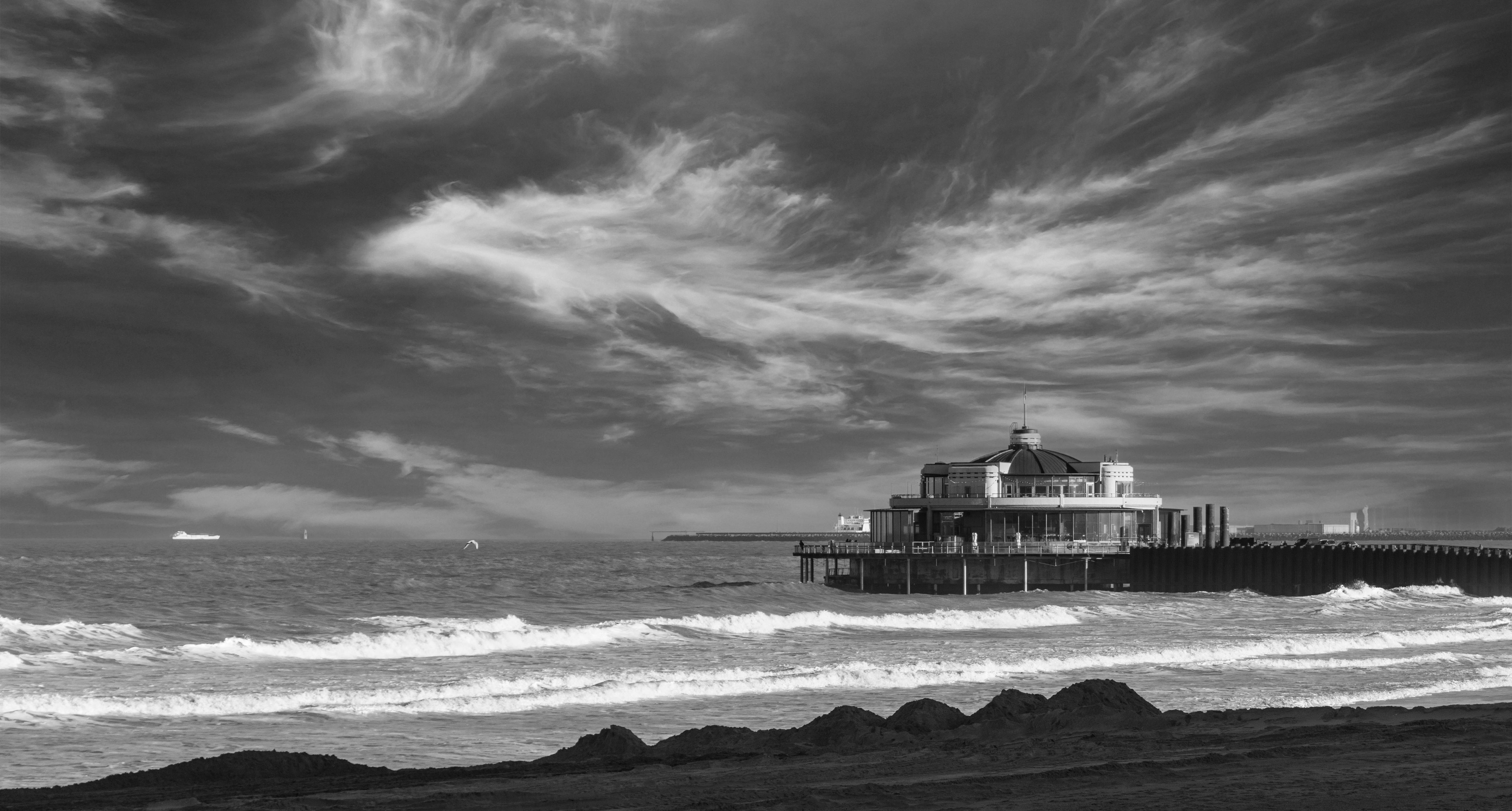Grayscale Photo of House on Beach · Free Stock Photo
