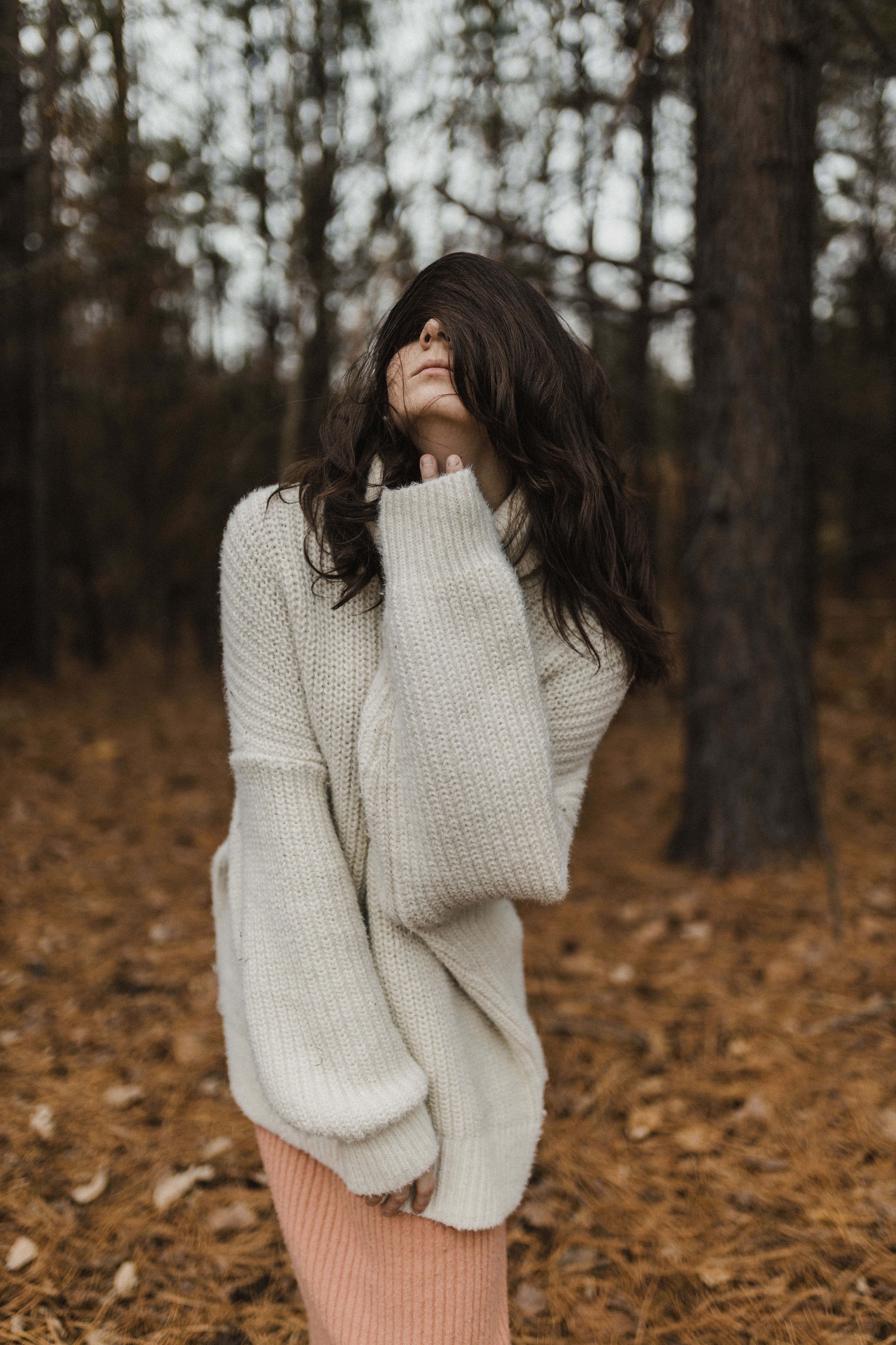Woman in White Sweater with Messy Hair · Free Stock Photo