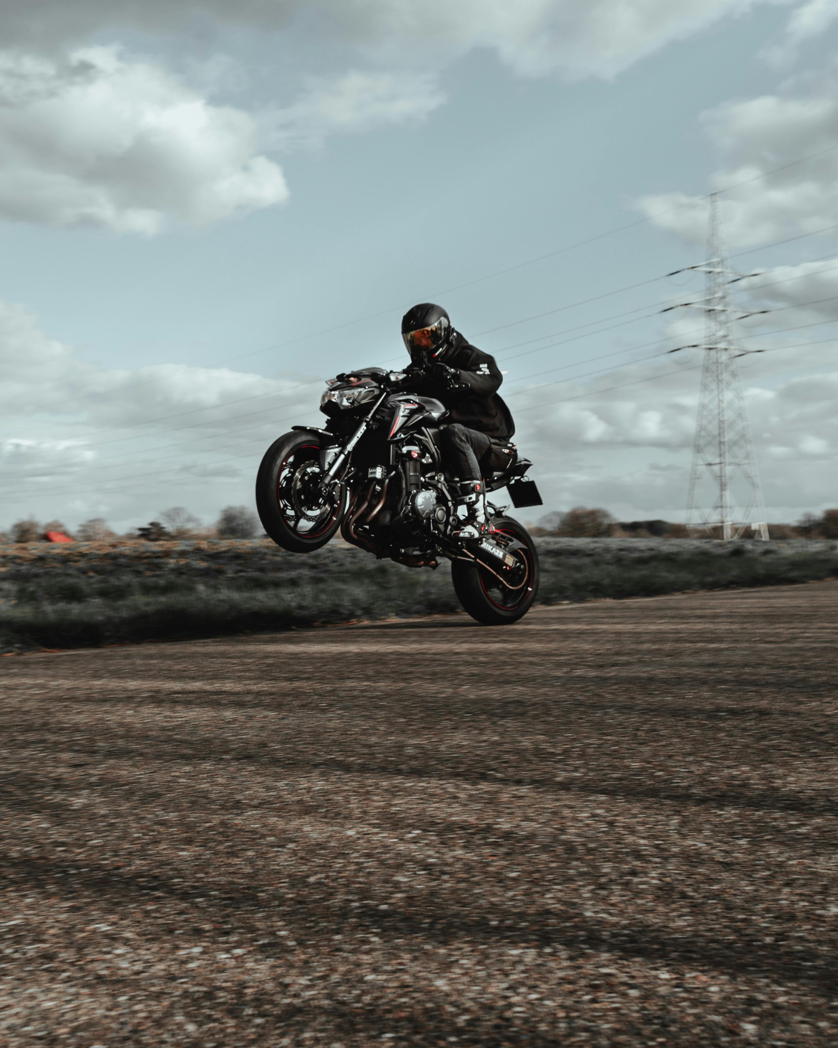 A Man Doing a Stunt with a Big Bike · Free Stock Photo
