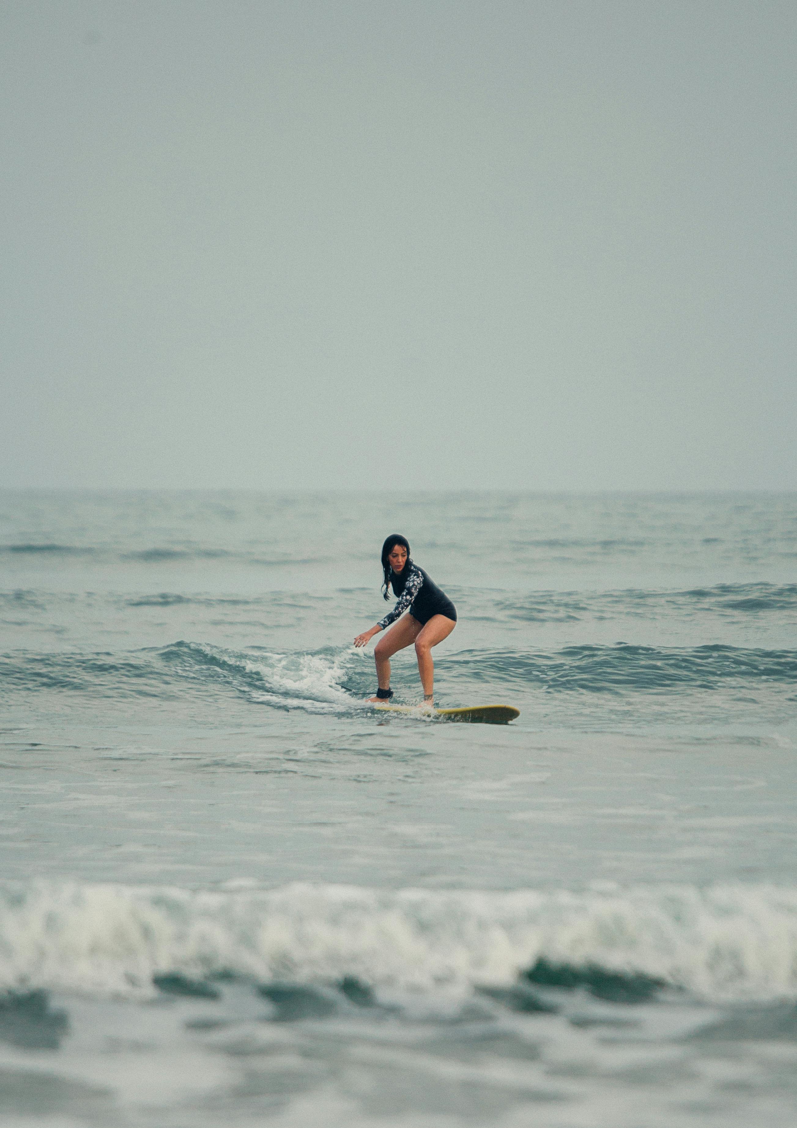 Woman Surfing on Waves · Free Stock Photo