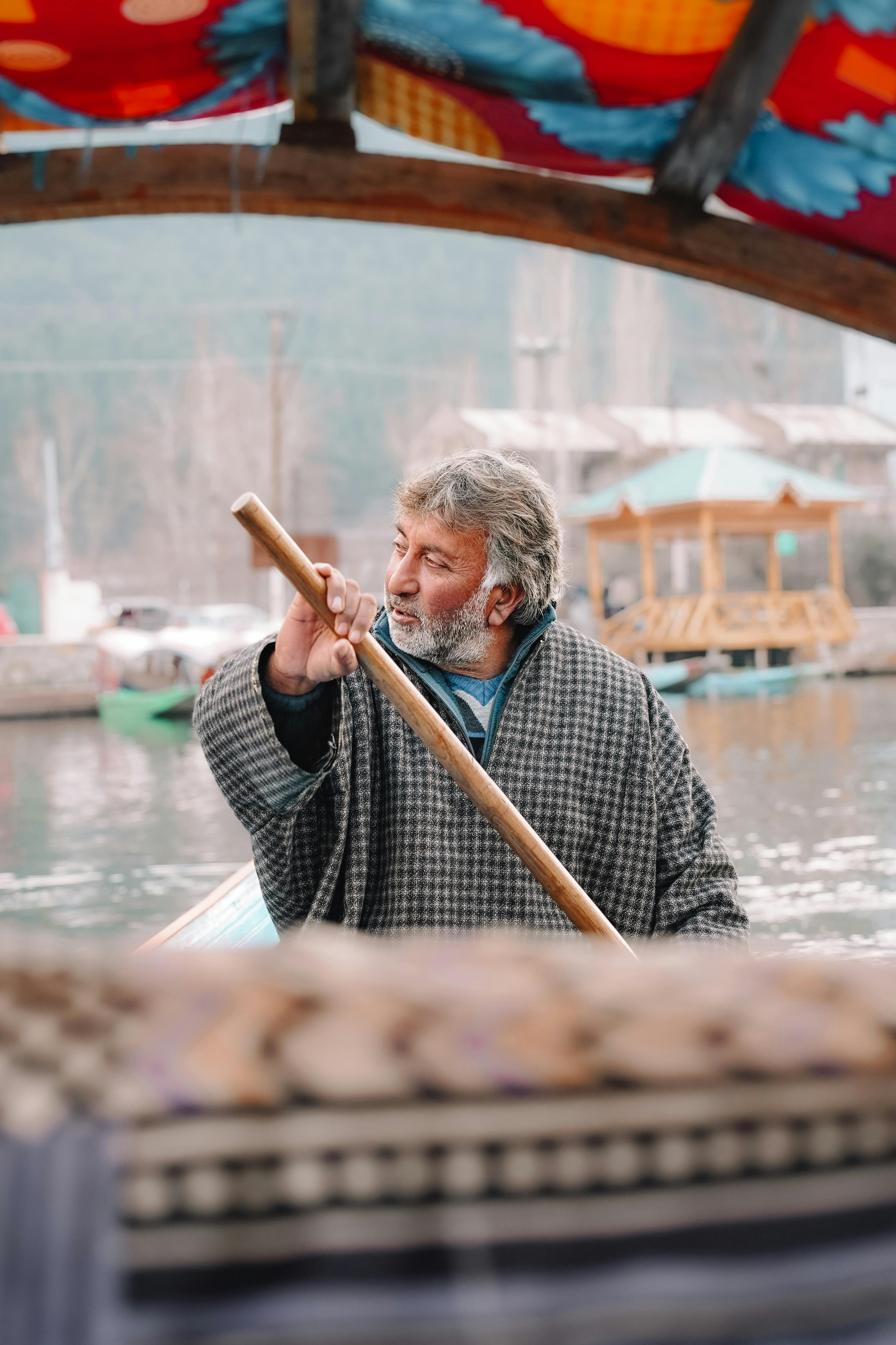 Man with Beard Rowing a Boat · Free Stock Photo