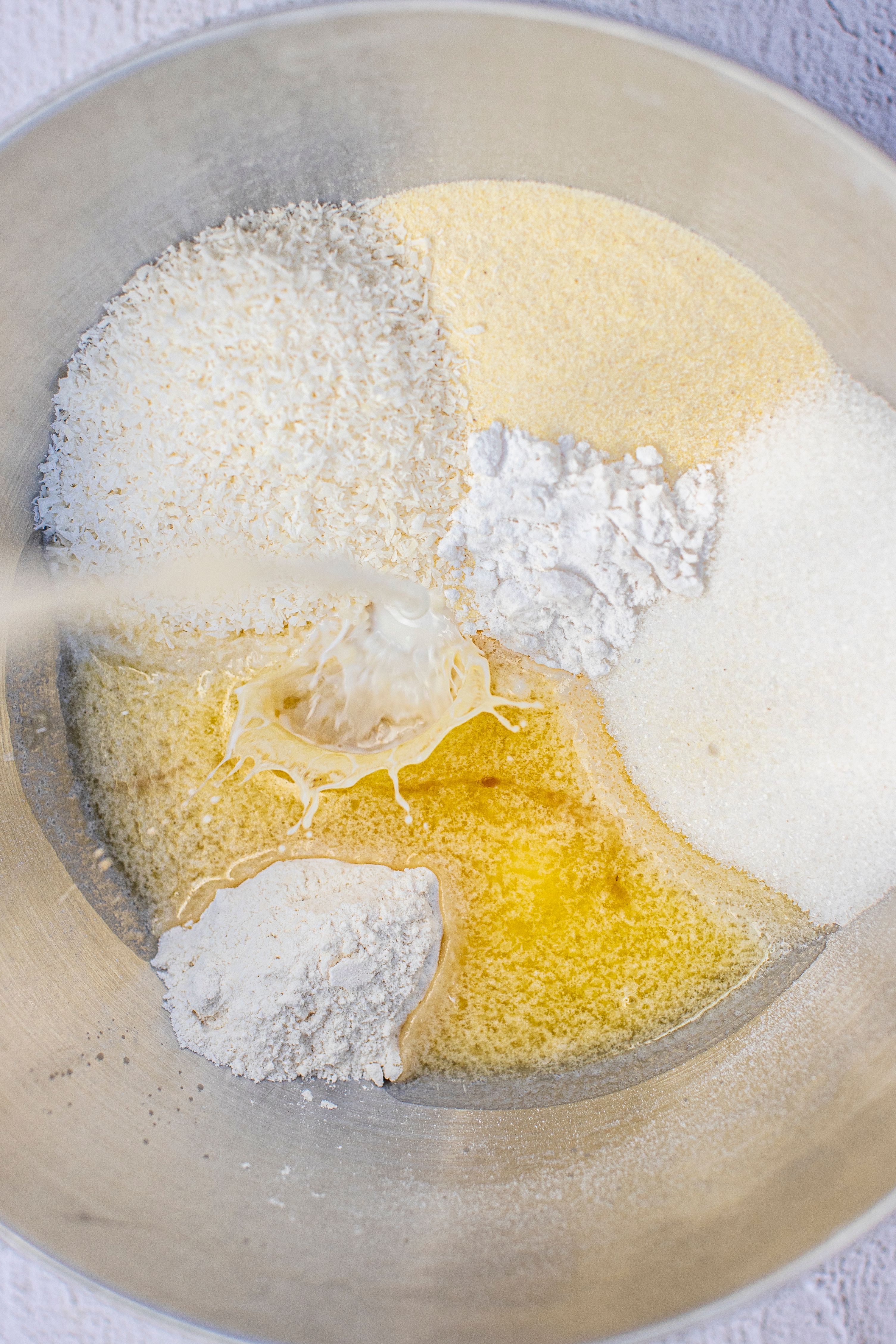 Person Mixing Batter on Silver Mixing Bowl · Free Stock Photo