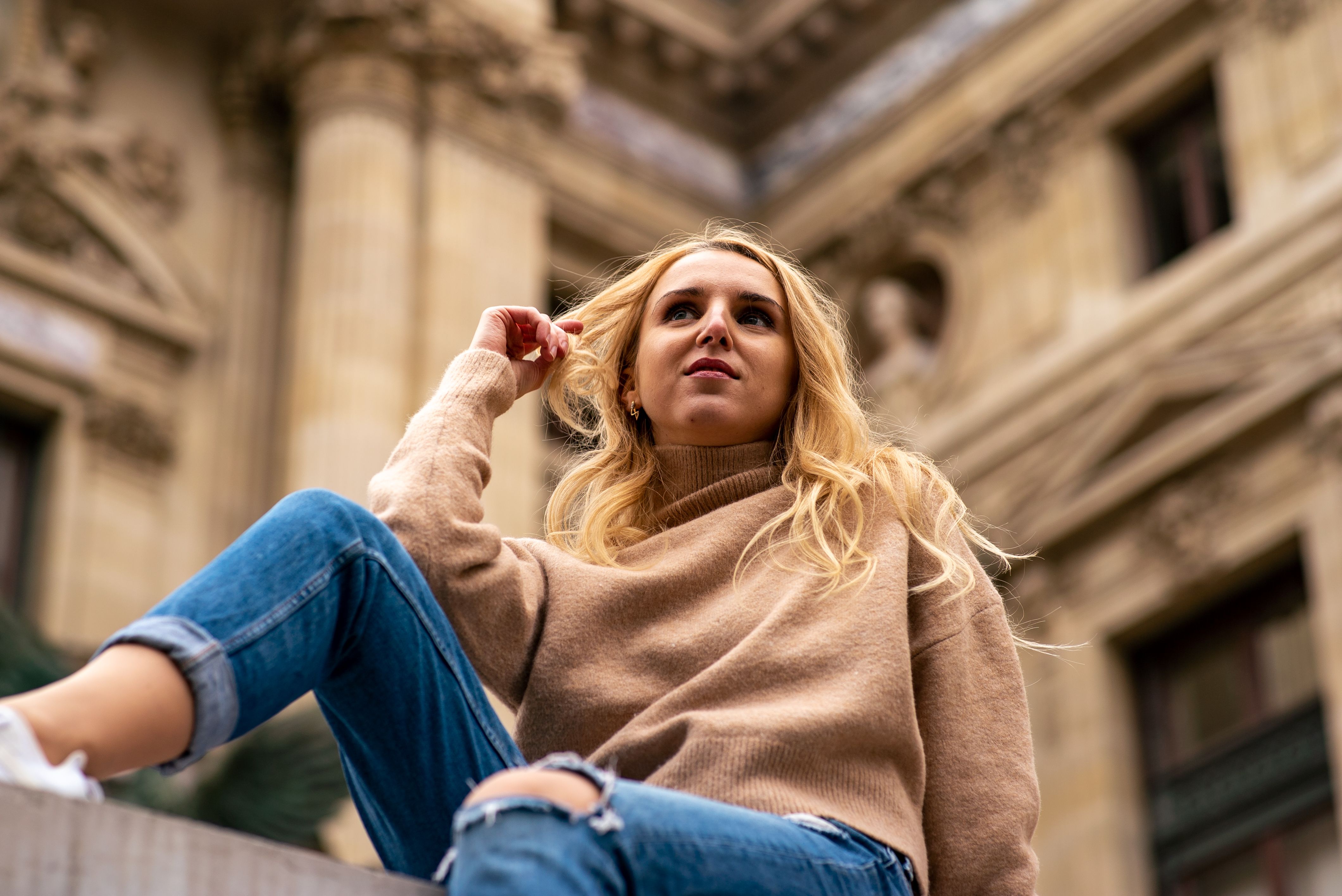 Woman Standing Next to Building · Free Stock Photo