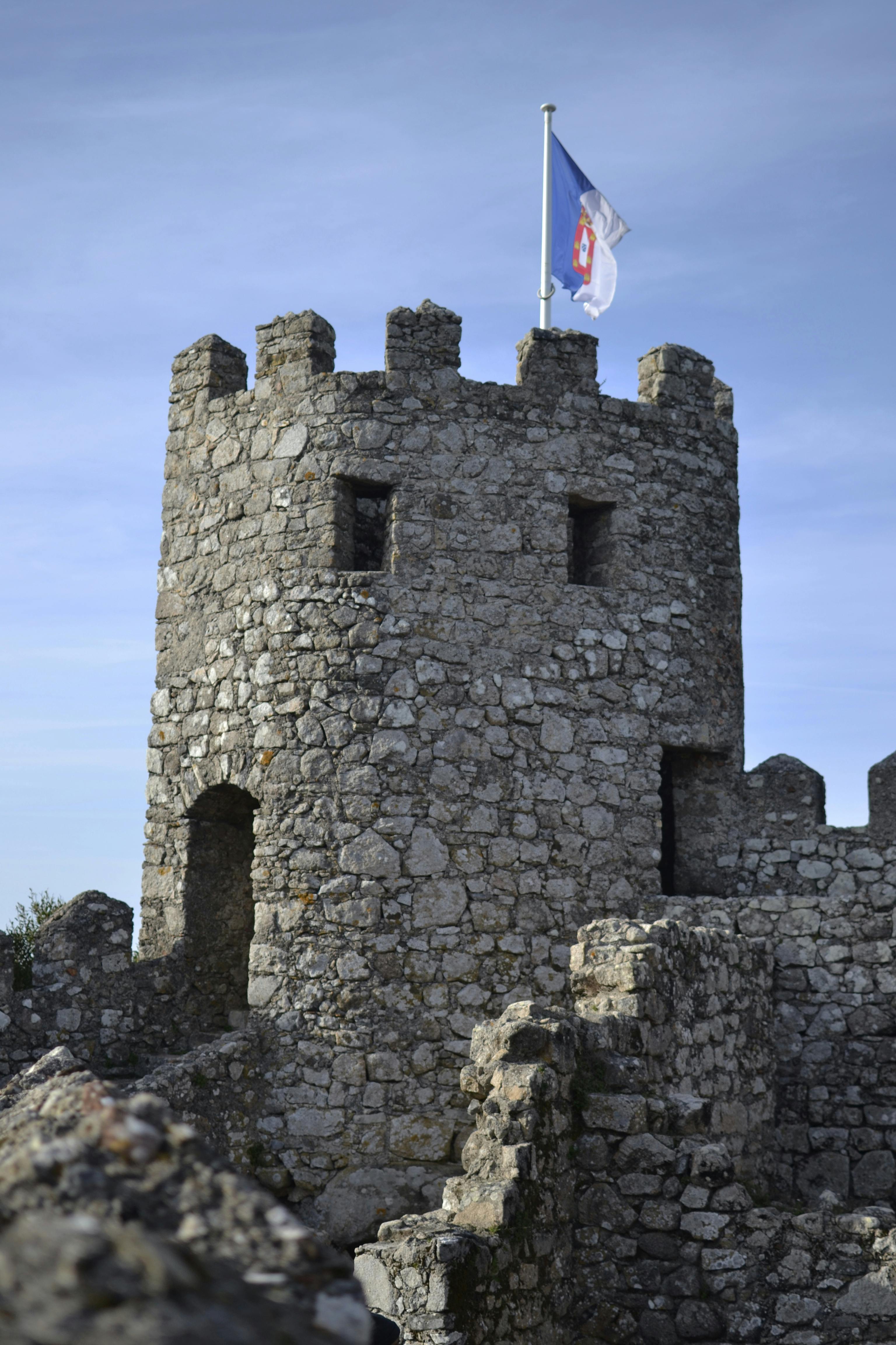 Medieval Tower with Portuguese Flag · Free Stock Photo