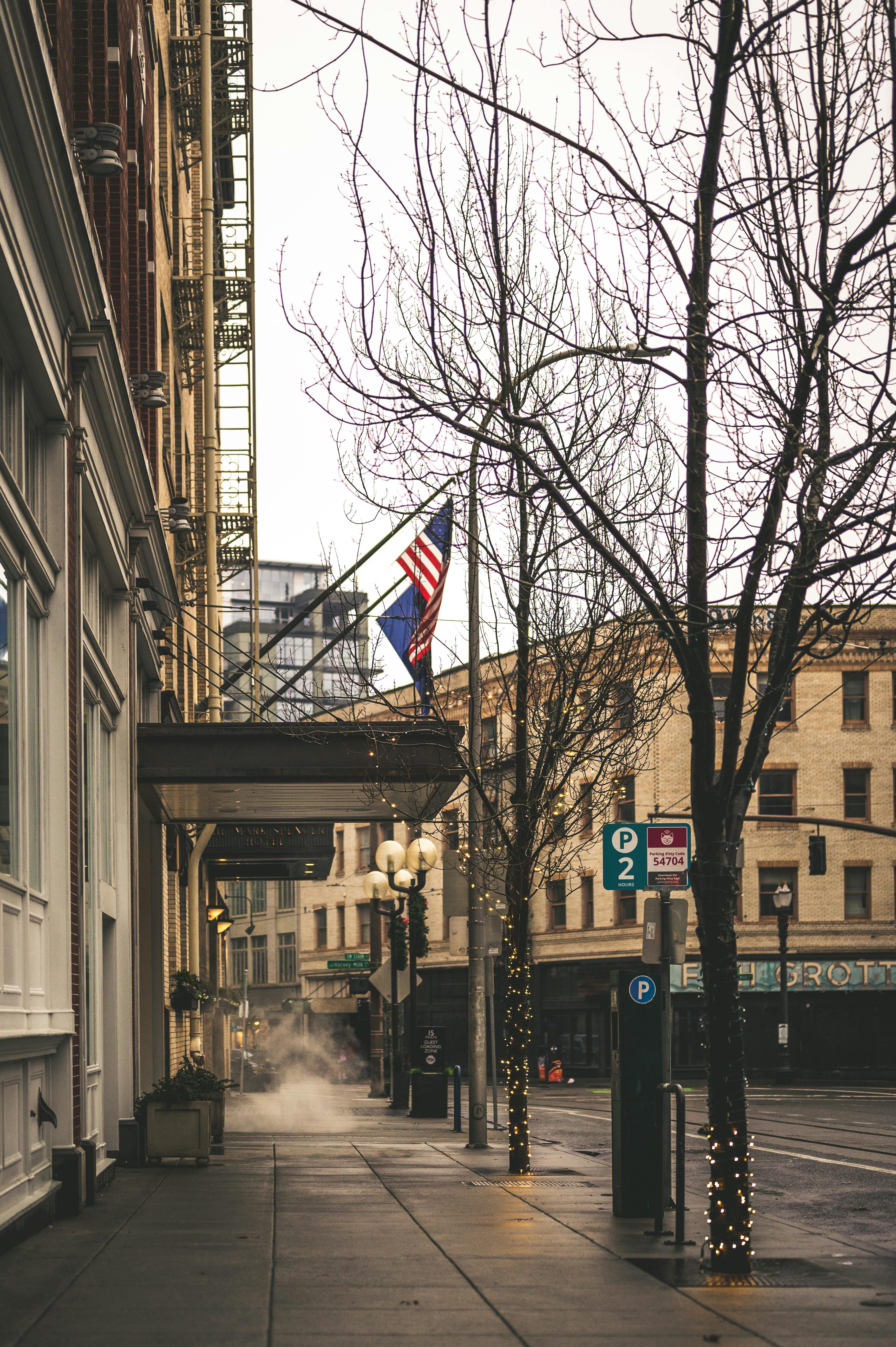 A Pavement Outside a Building with Flag · Free Stock Photo