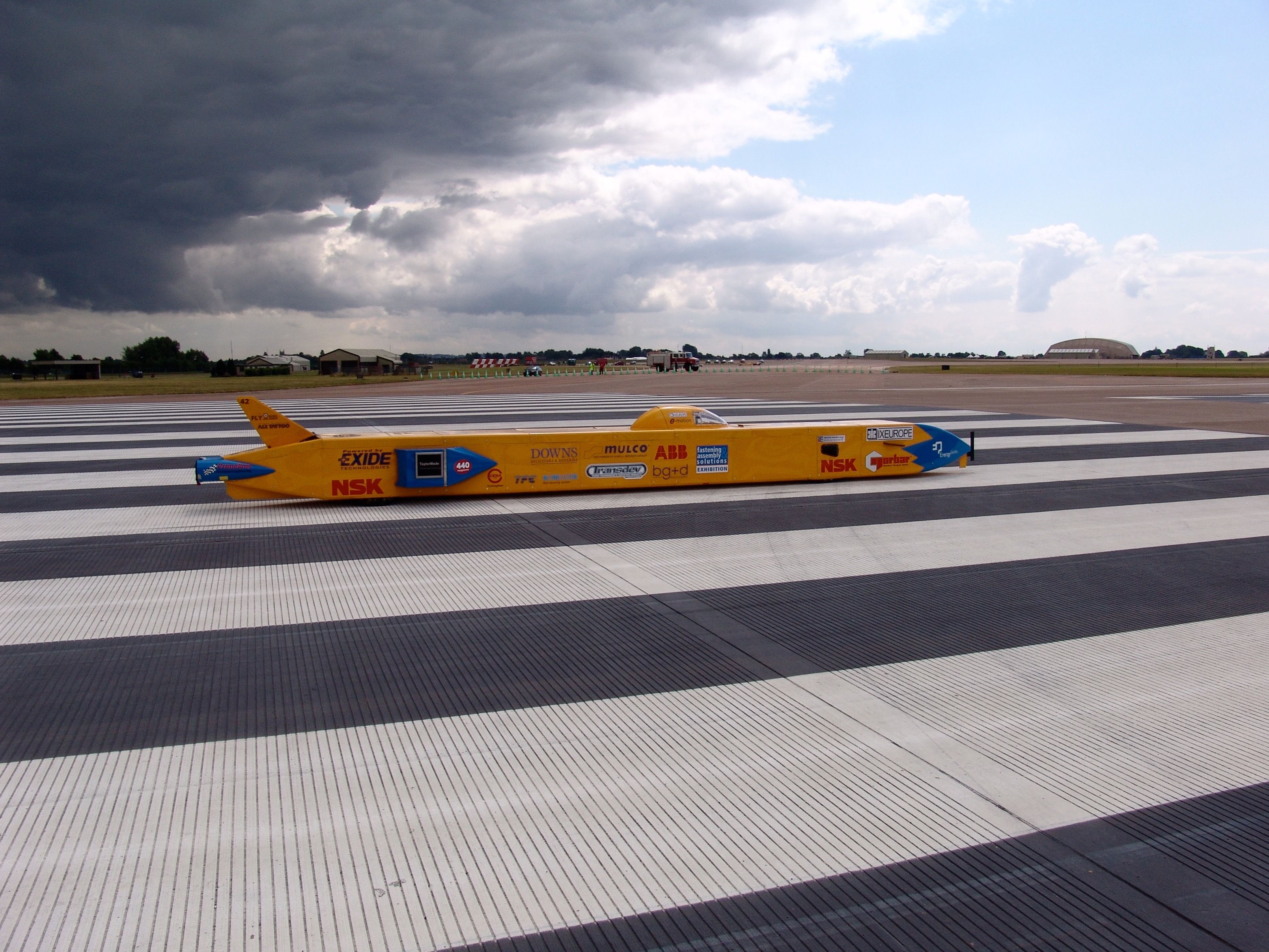 A Yellow and Blue Aircraft on Runway · Free Stock Photo