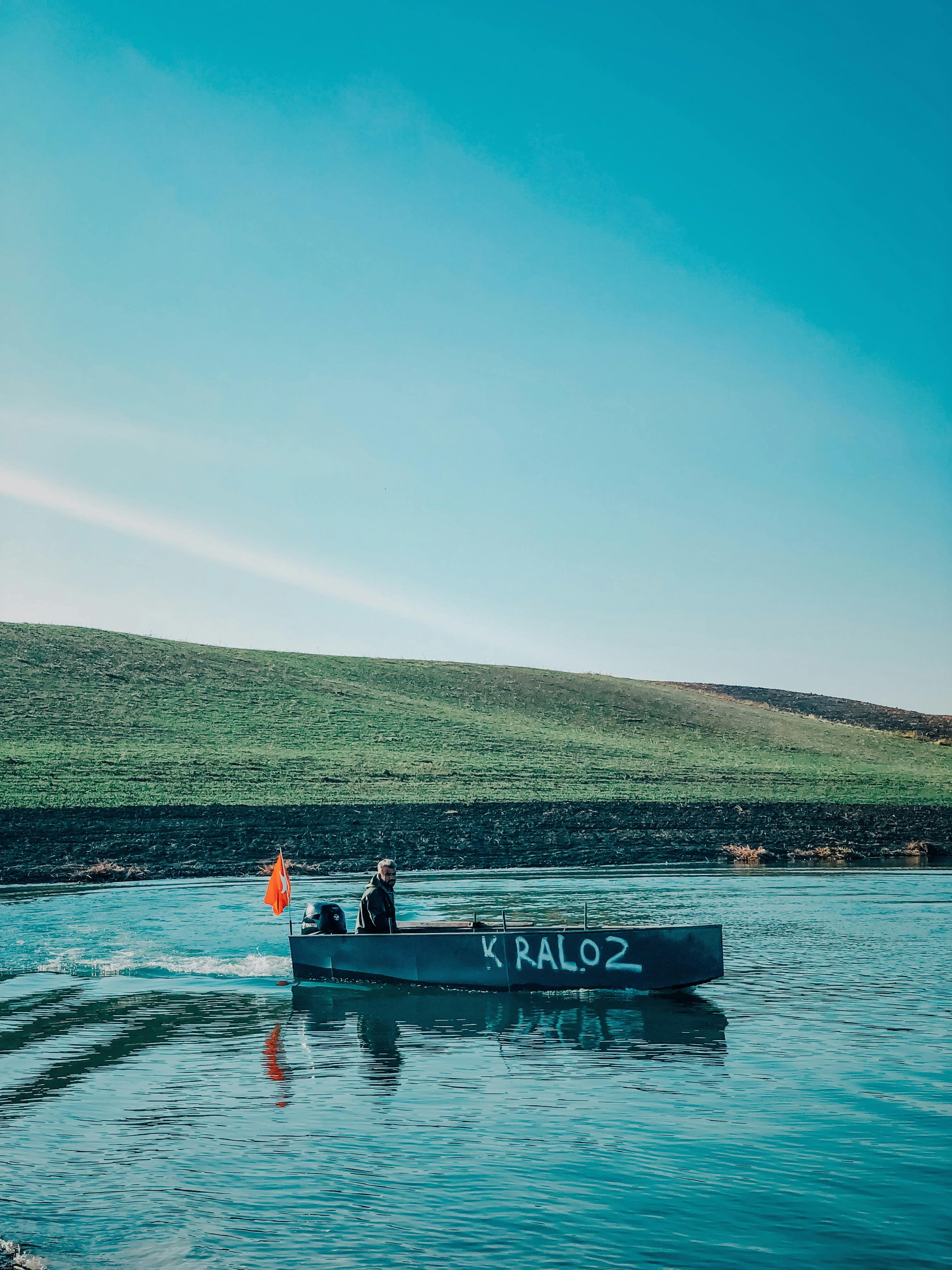 A Man Riding a Boat · Free Stock Photo