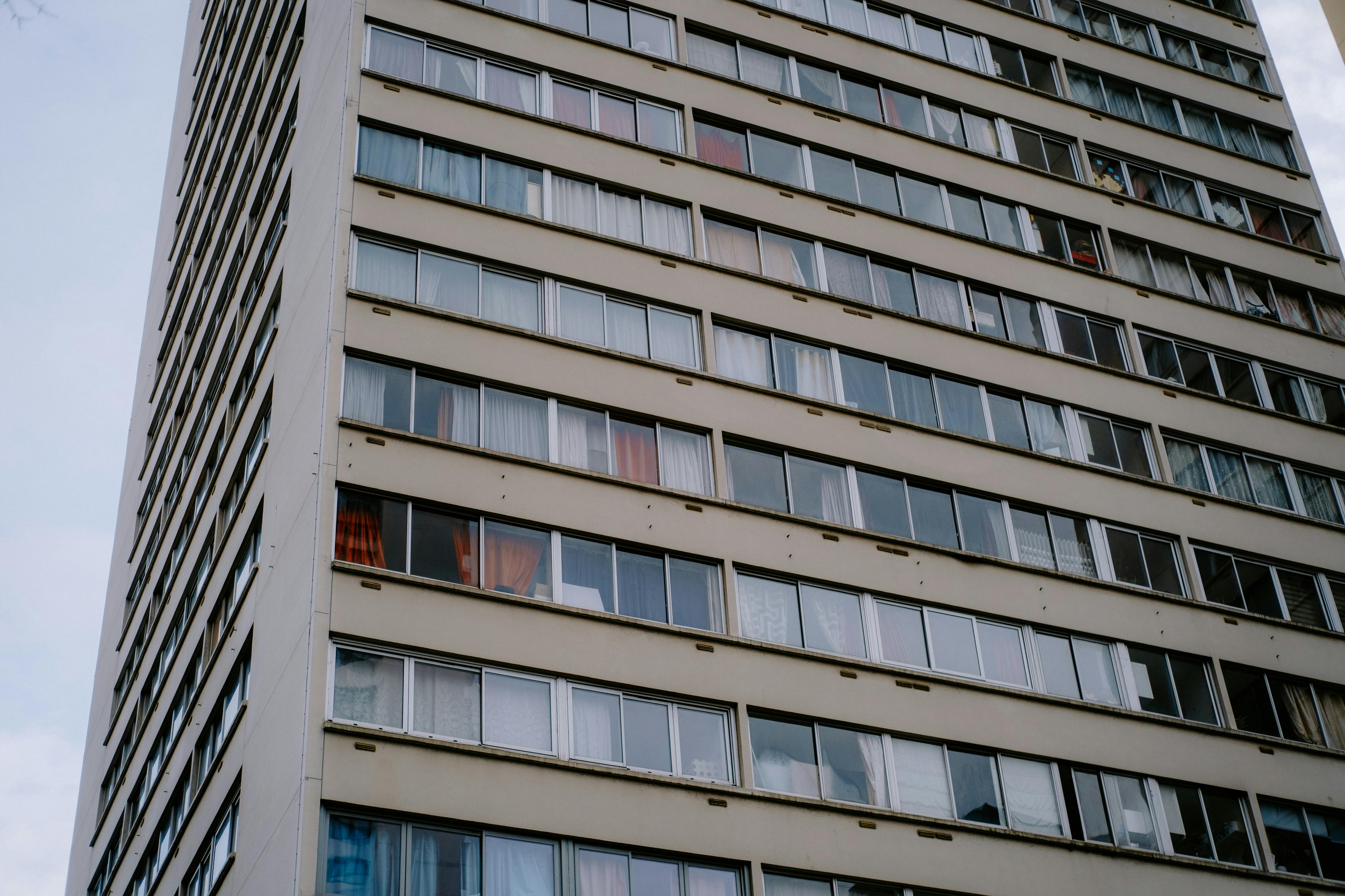 Photo of a High-Rise Building with Glass Windows · Free Stock Photo