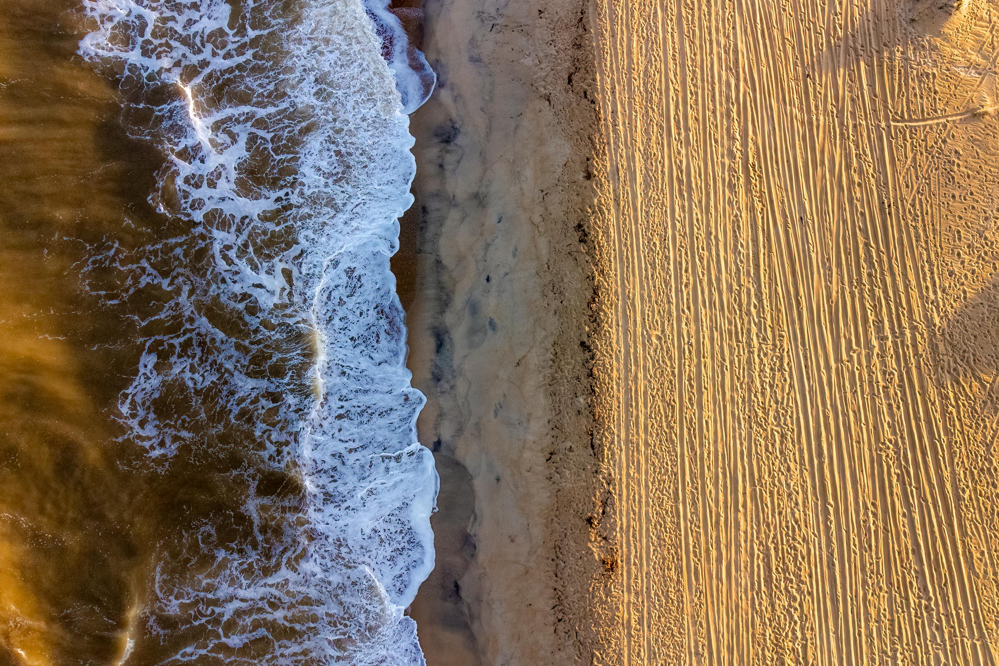 Waves Kissing the Beach Shore Brown Sand · Free Stock Photo