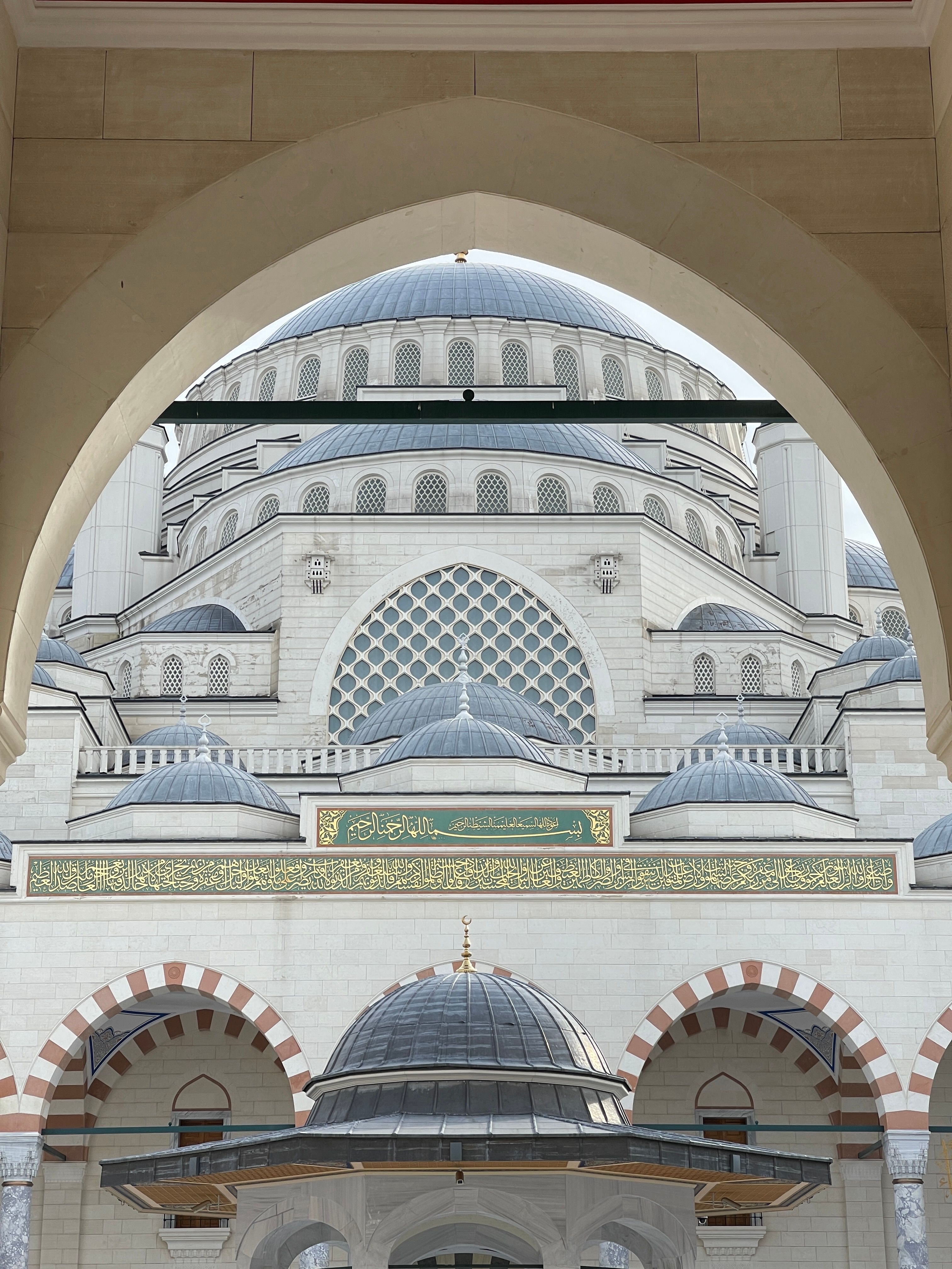 A Person Praying while Kneeling in a Mosque · Free Stock Photo