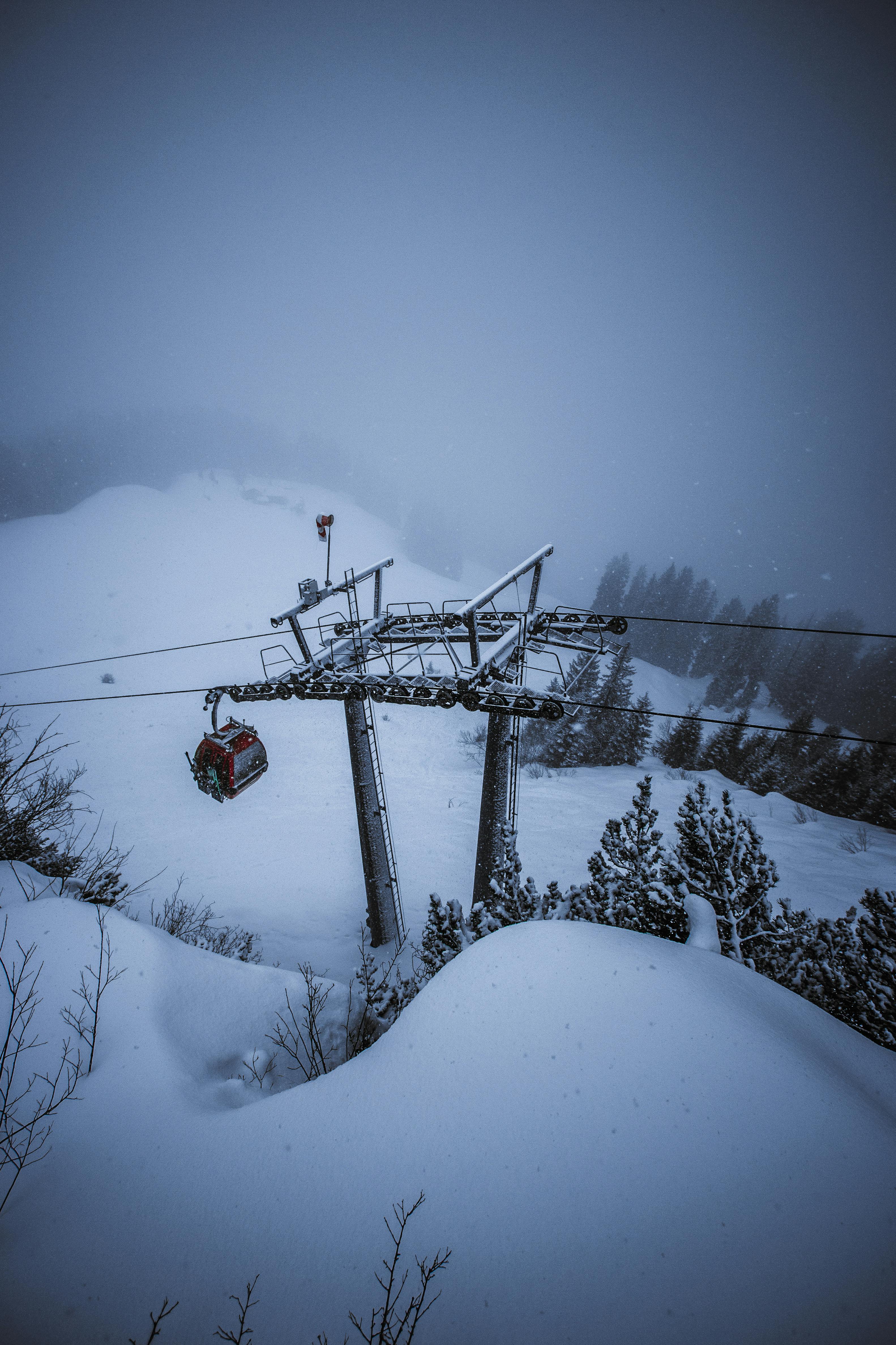 Aerial Photography of Red Ski Lift over Snow Covered Ground · Free ...