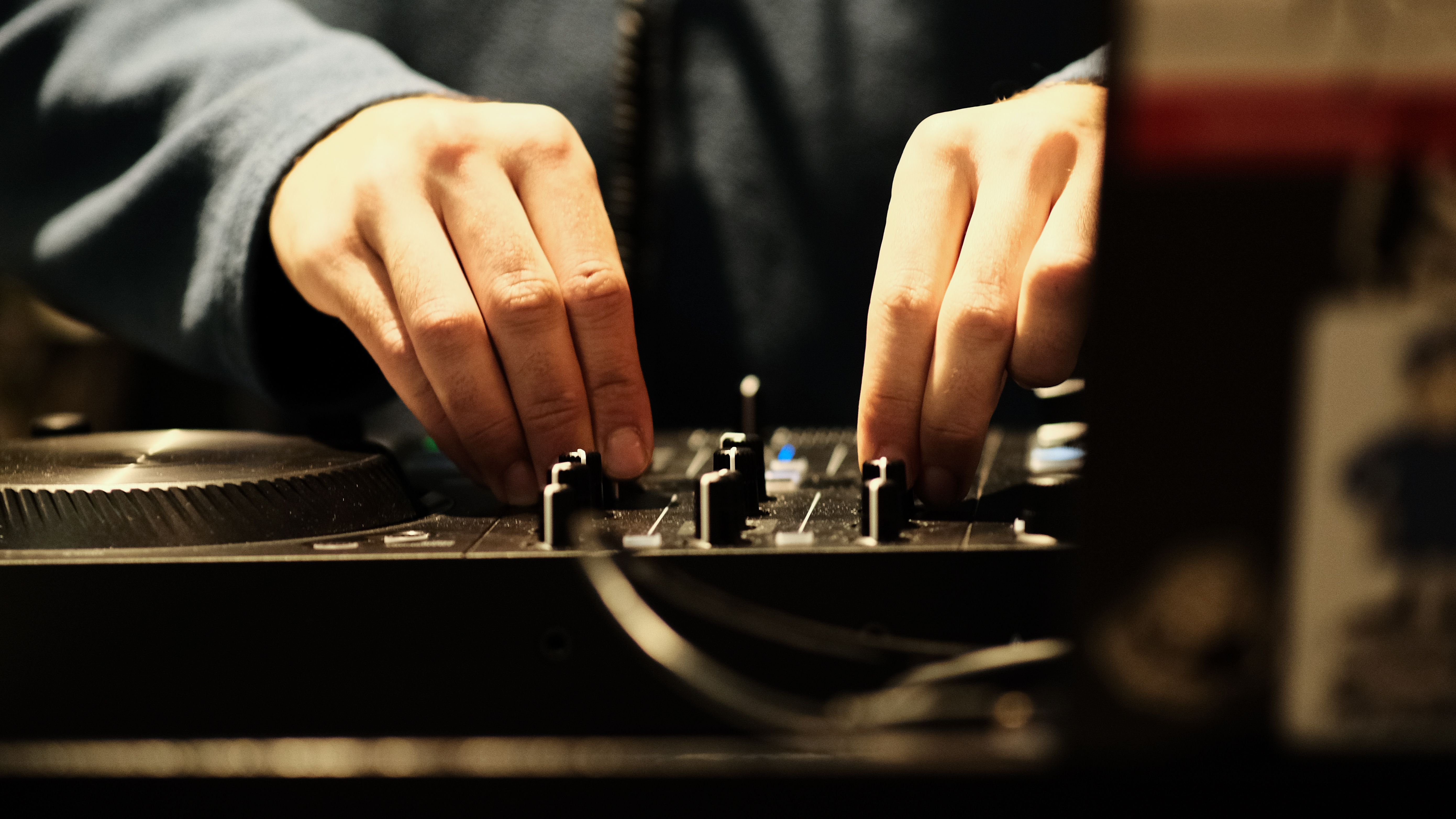 Man Mixing Music on a Console · Free Stock Photo