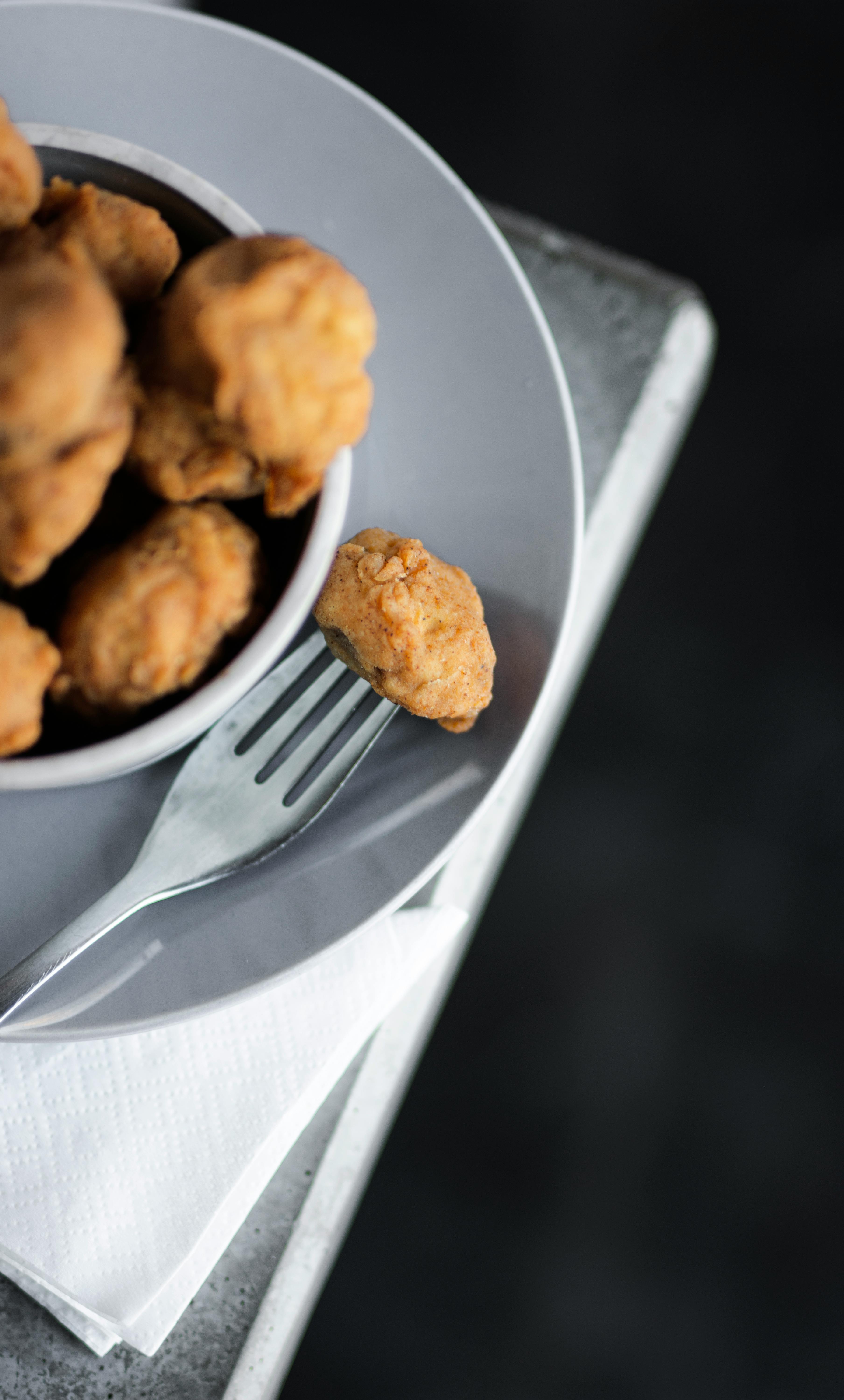 Deep Fried Chicken Wing on a Fork · Free Stock Photo