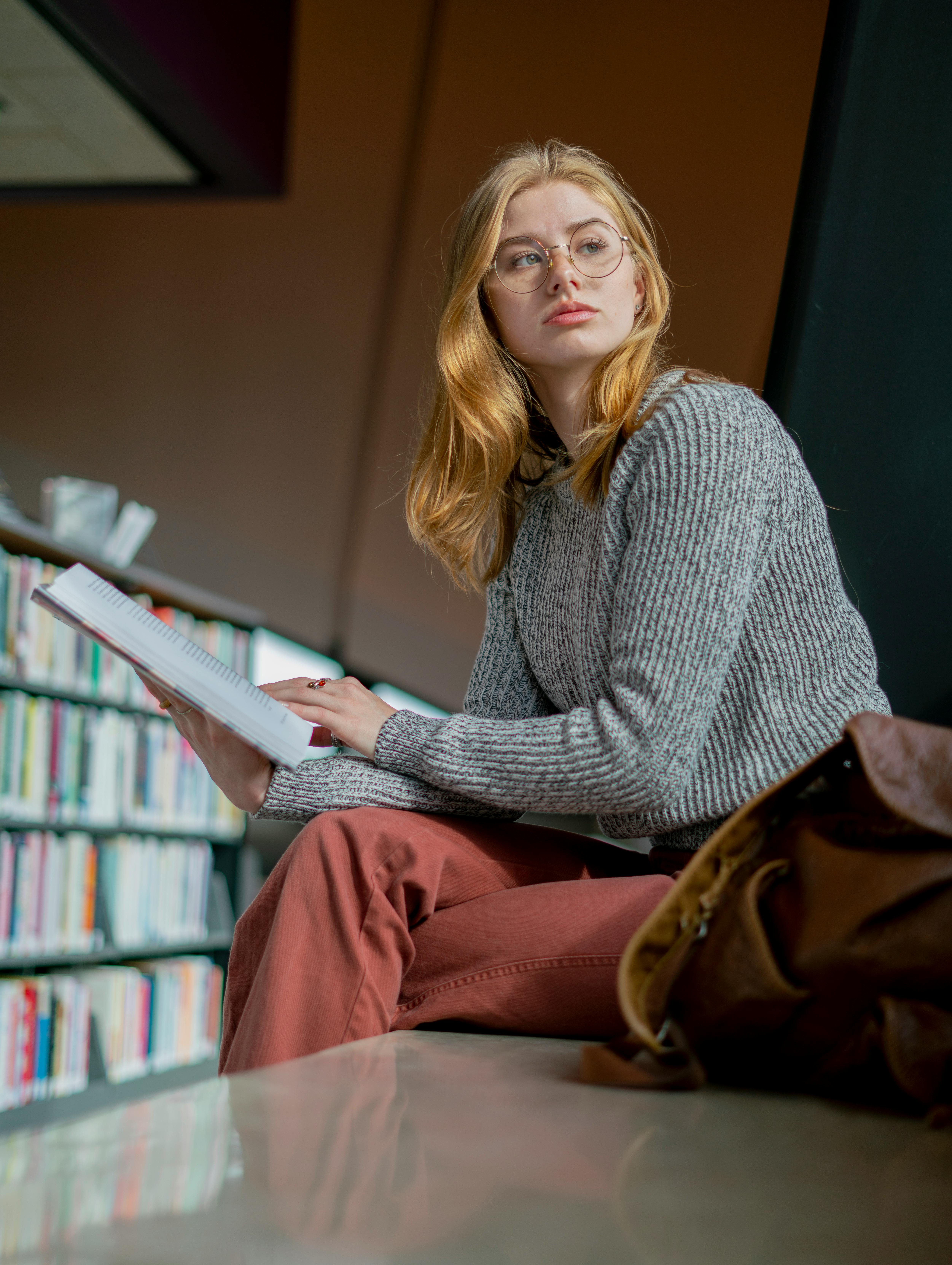 Woman Studying in Library · Free Stock Photo
