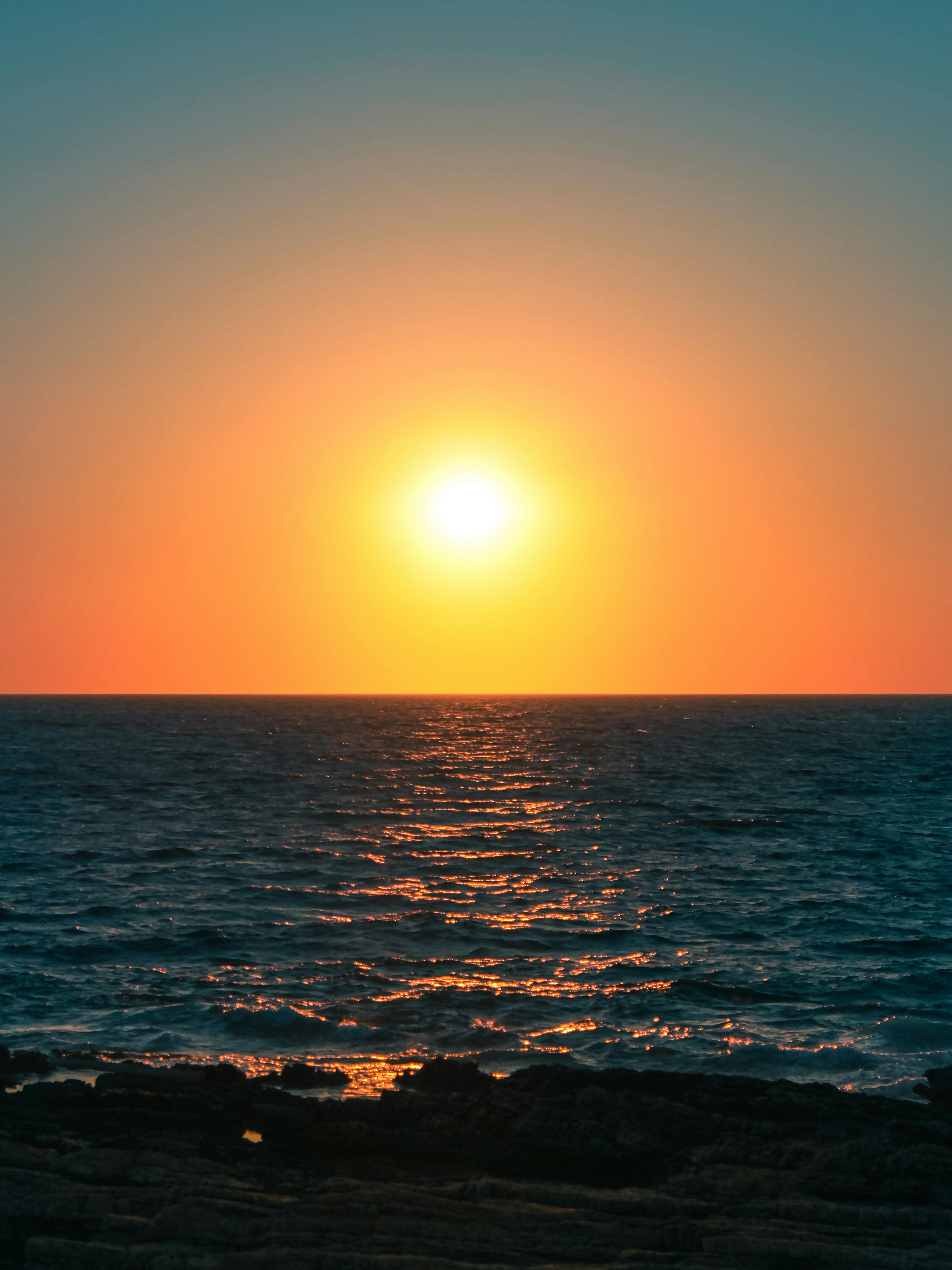 Body of Water during Sunset · Free Stock Photo