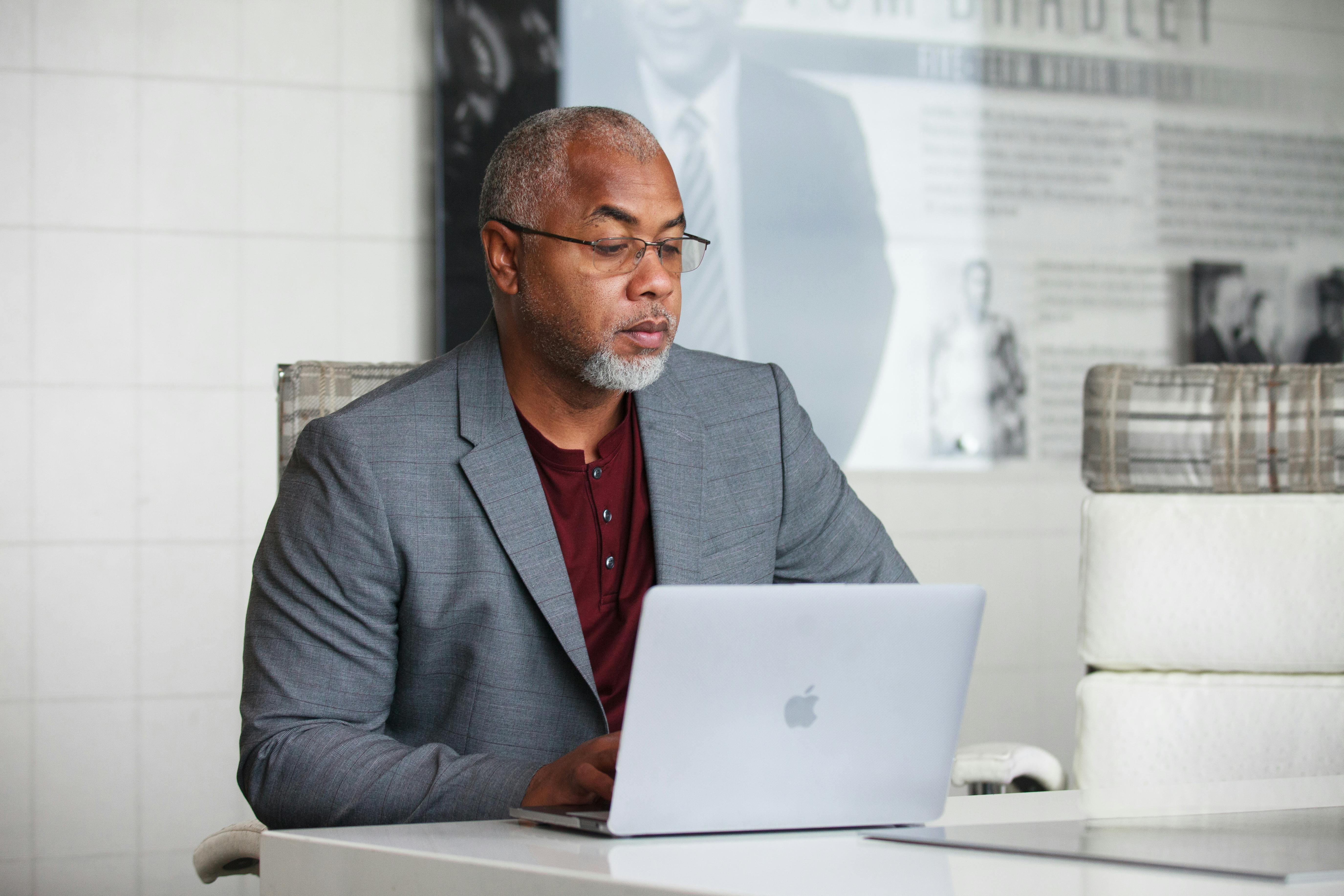 Man Working on a Laptop · Free Stock Photo