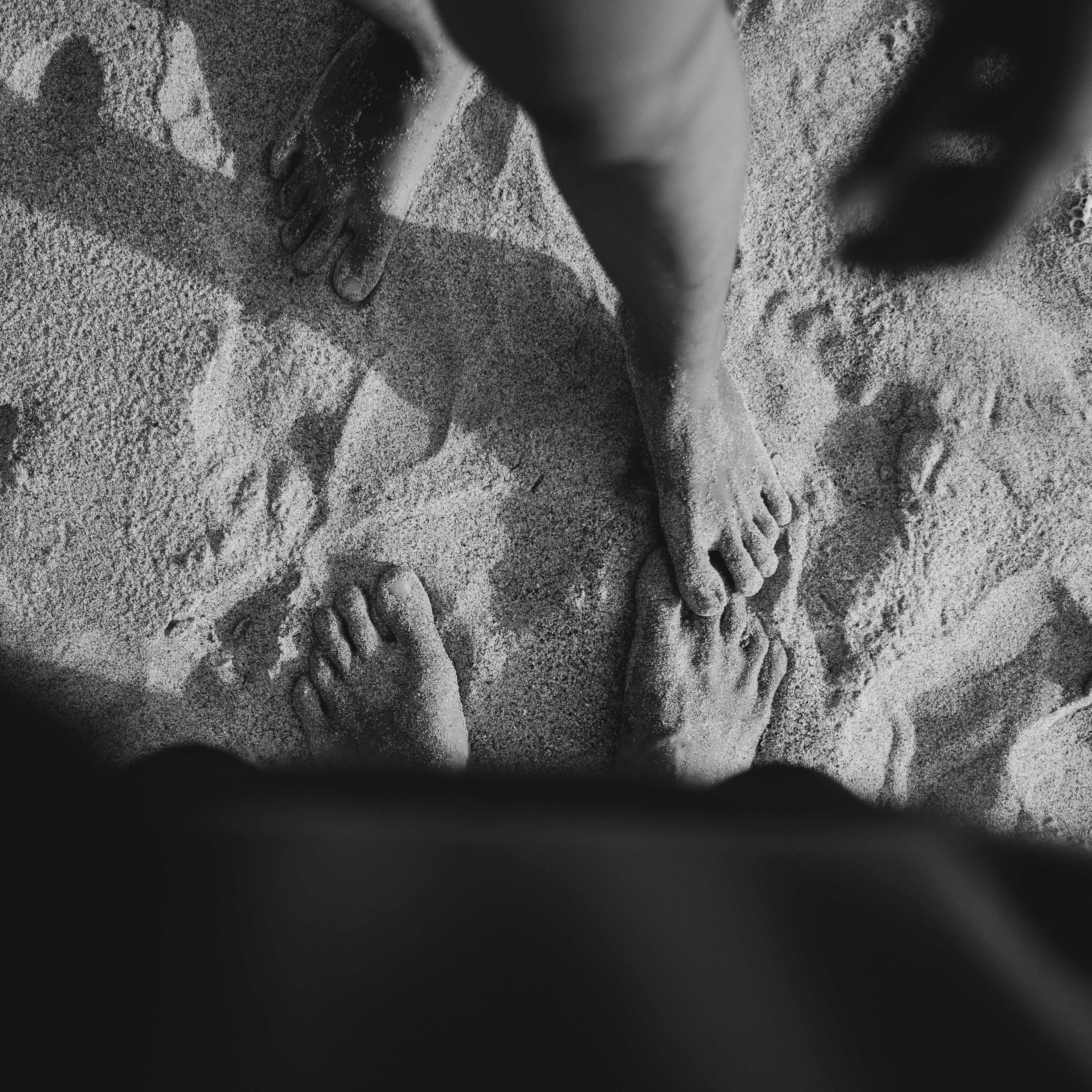 High-Angle Shot of a Person Standing Barefoot on the Sand · Free Stock ...
