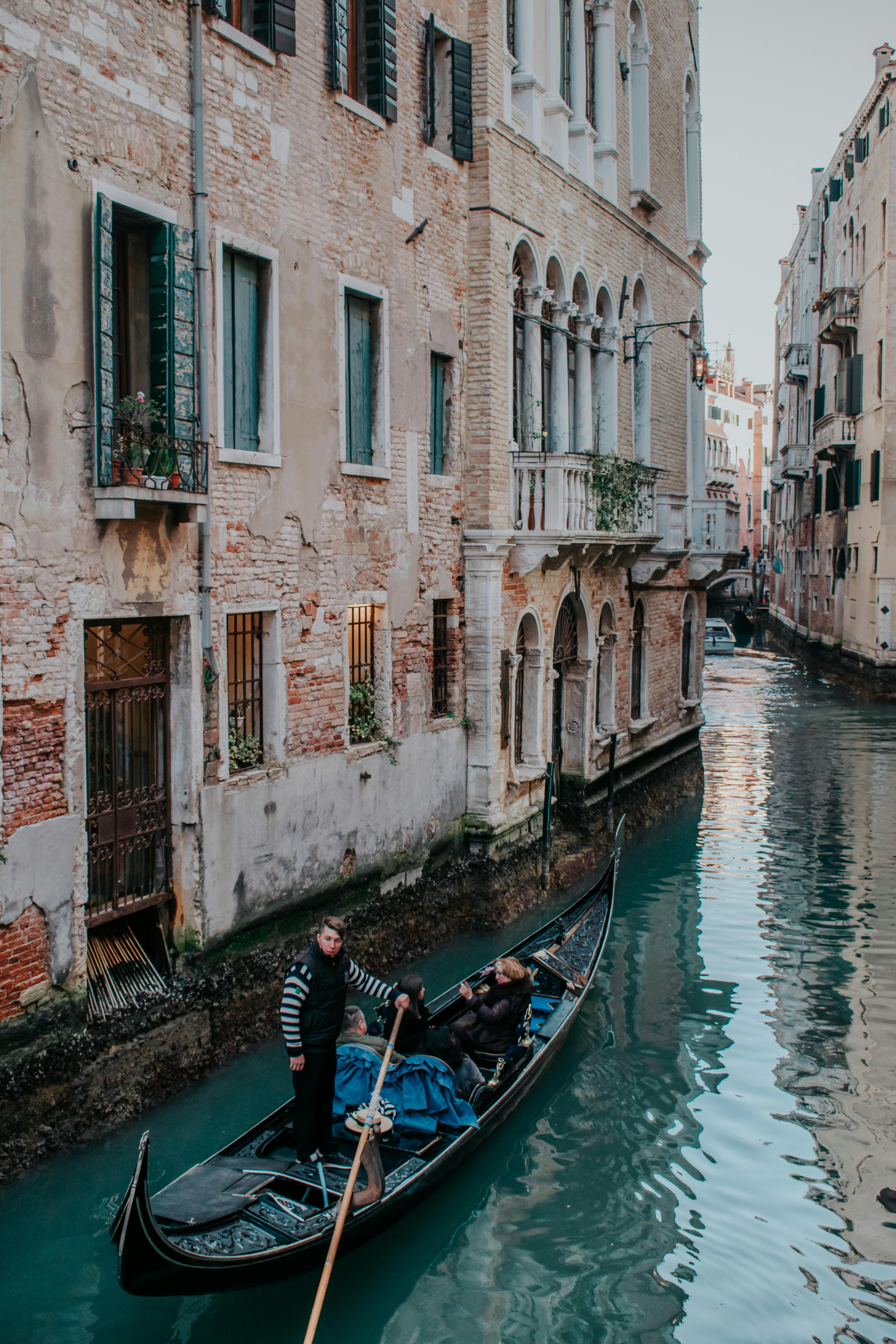A People Riding a Boat on a River · Free Stock Photo