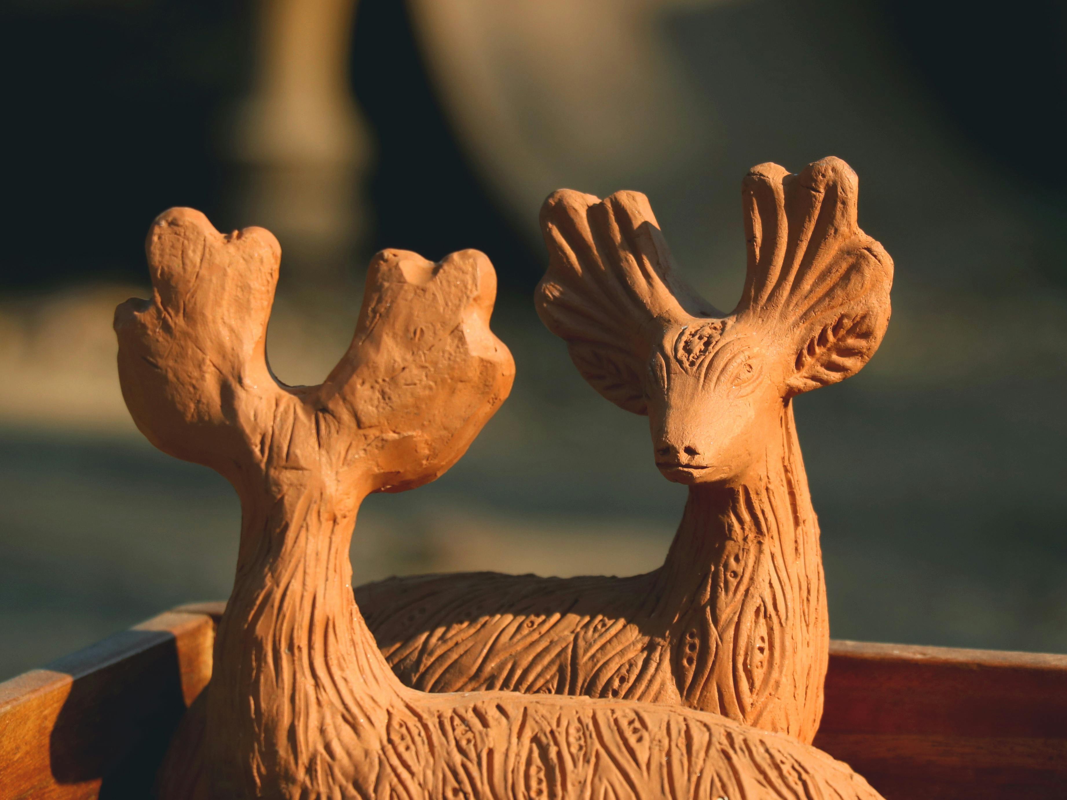 Photo of Clay Deer Sculptures · Free Stock Photo