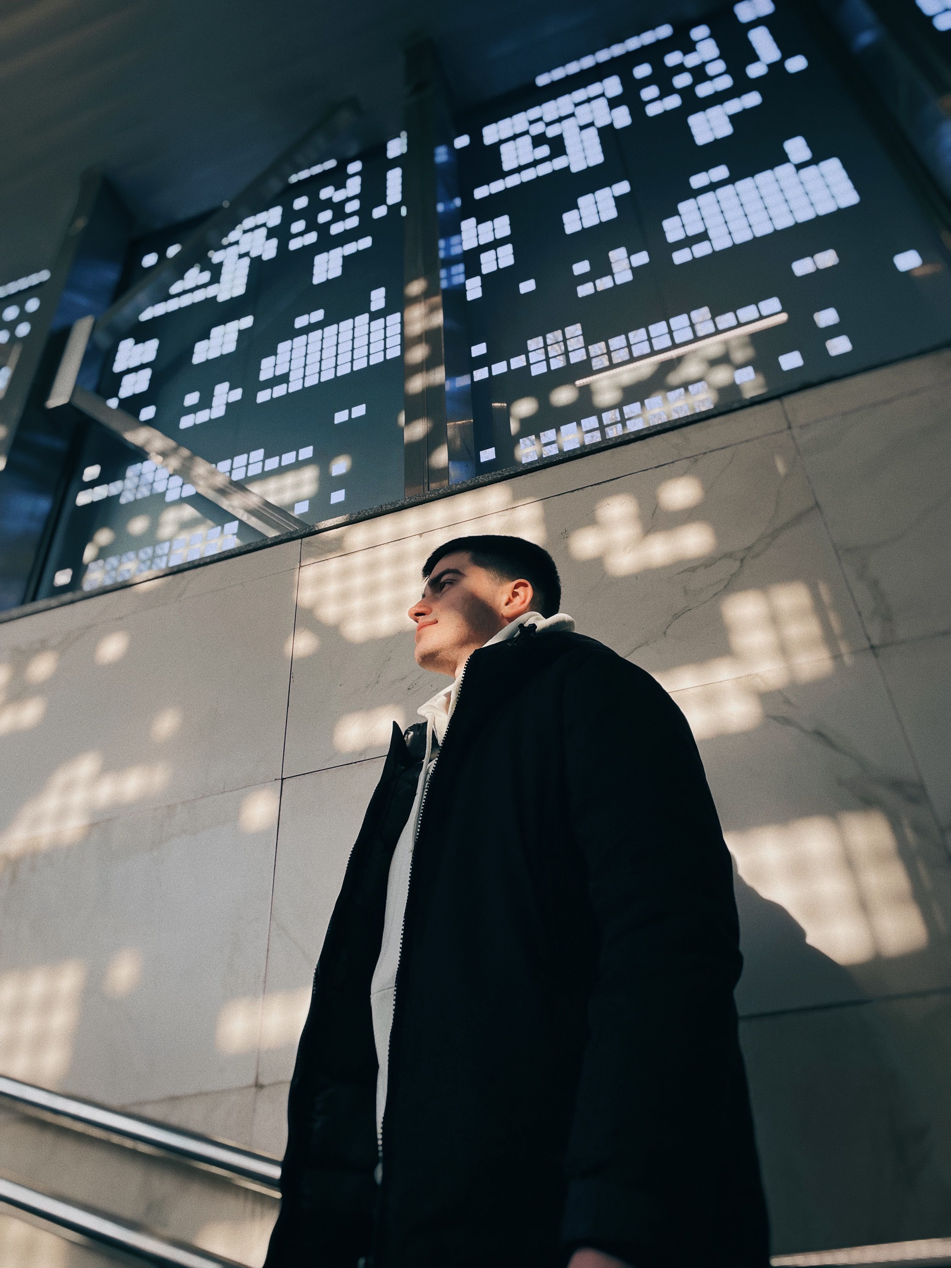Man Standing Against the Wall and Touching It · Free Stock Photo