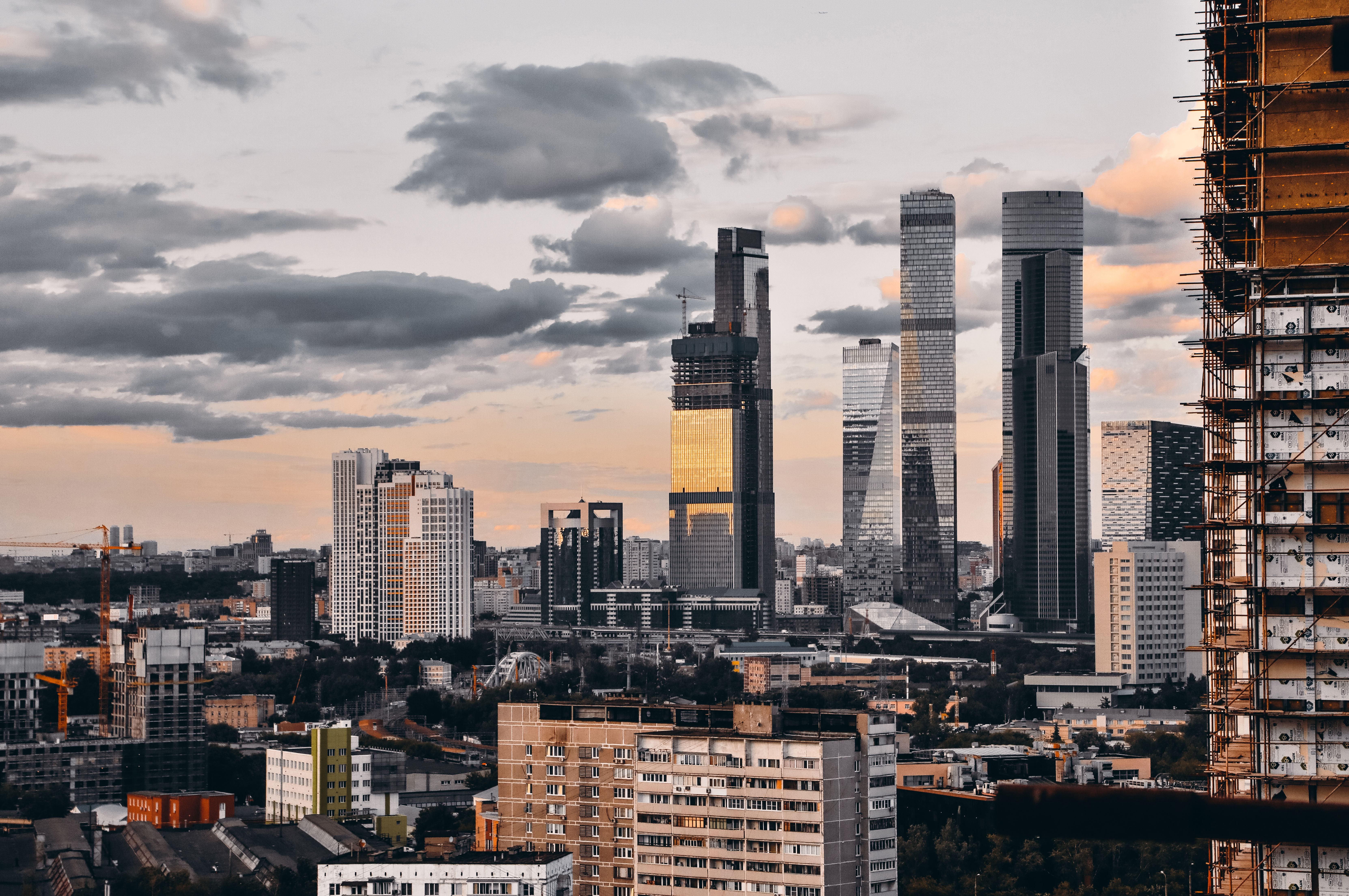 Aerial Photography of City Skyline Under Cloudy Sky · Free Stock Photo