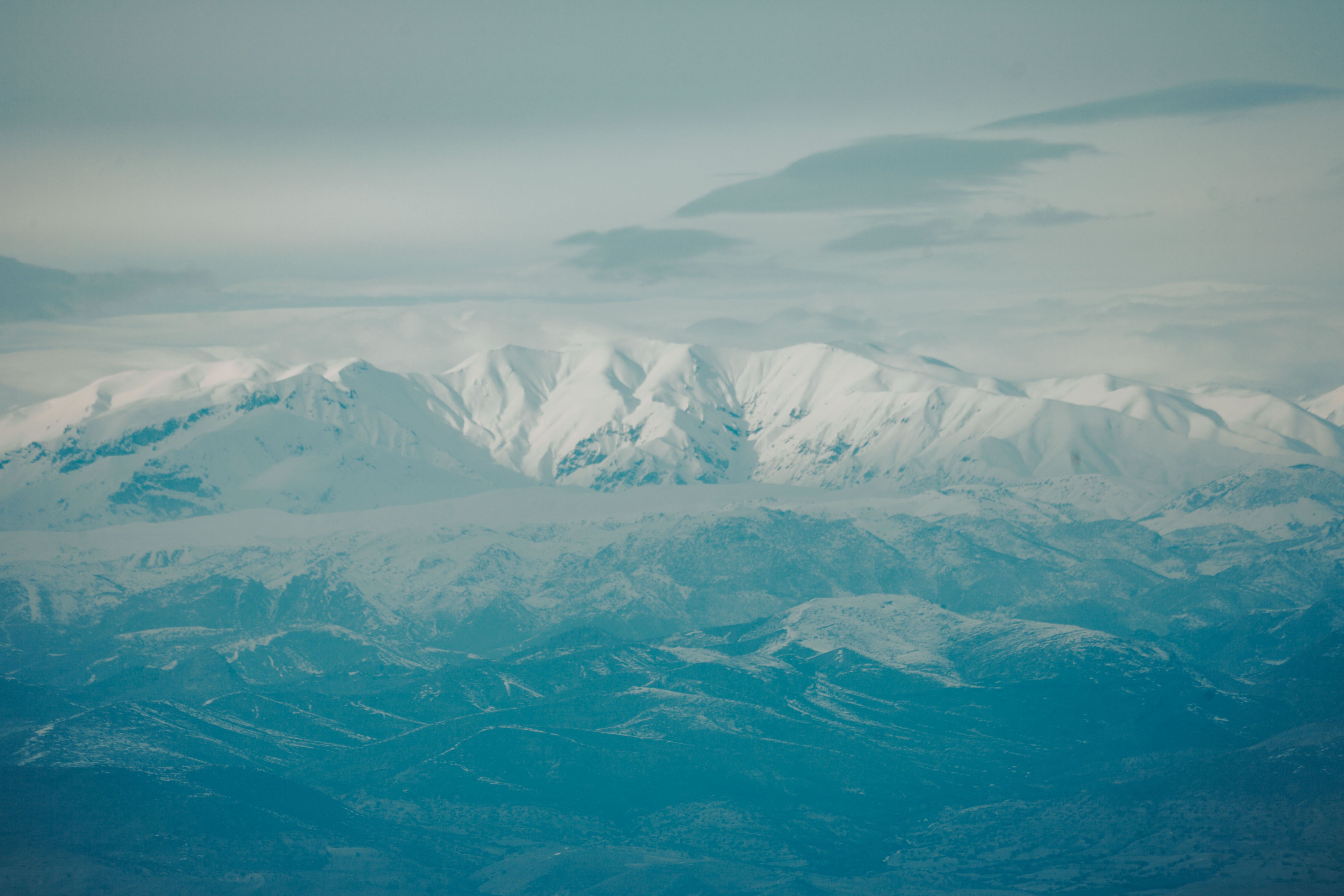 An Aerial Photography of Snow Covered Mountains · Free Stock Photo