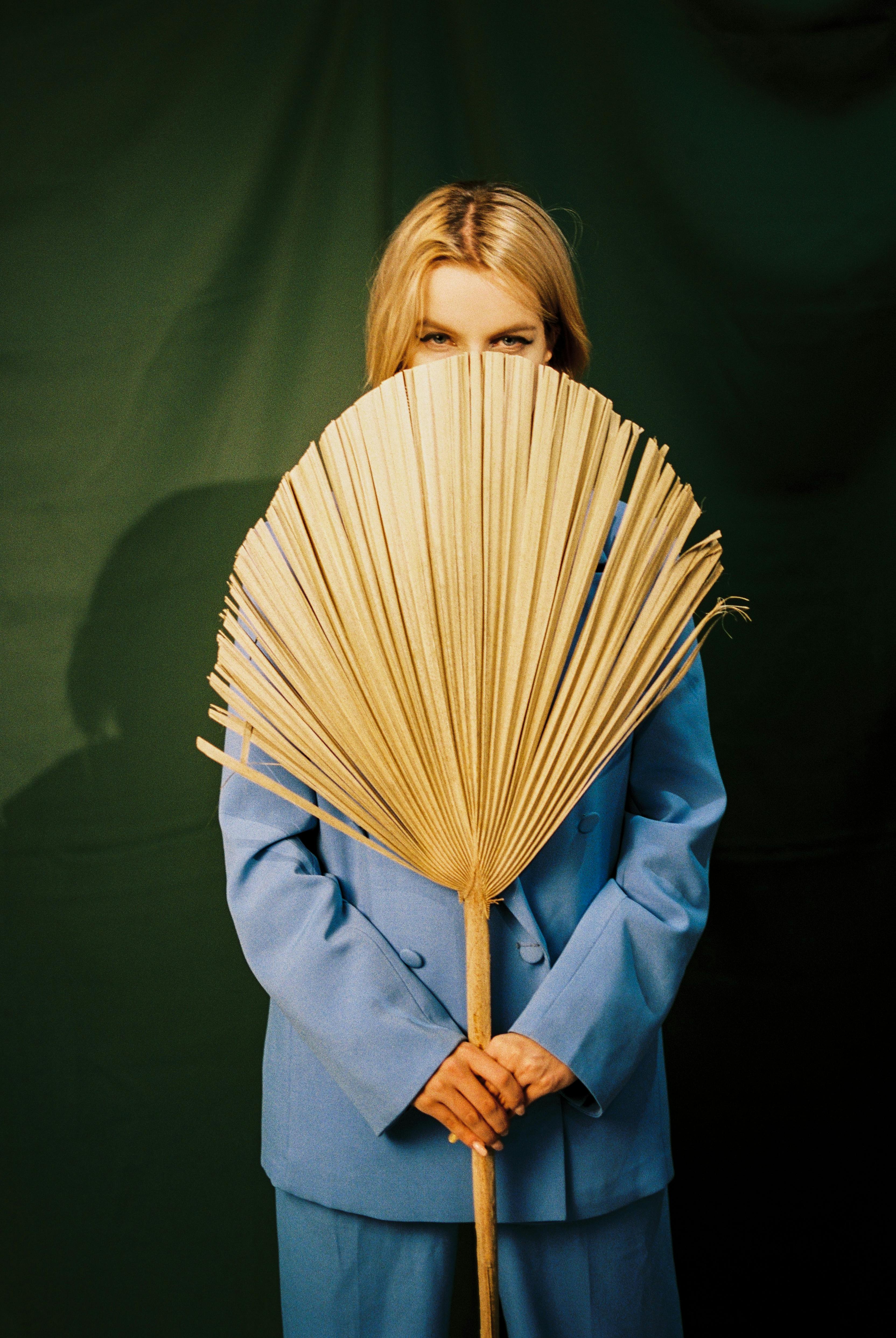 Blond Haired Woman Holding Hand Fan · Free Stock Photo