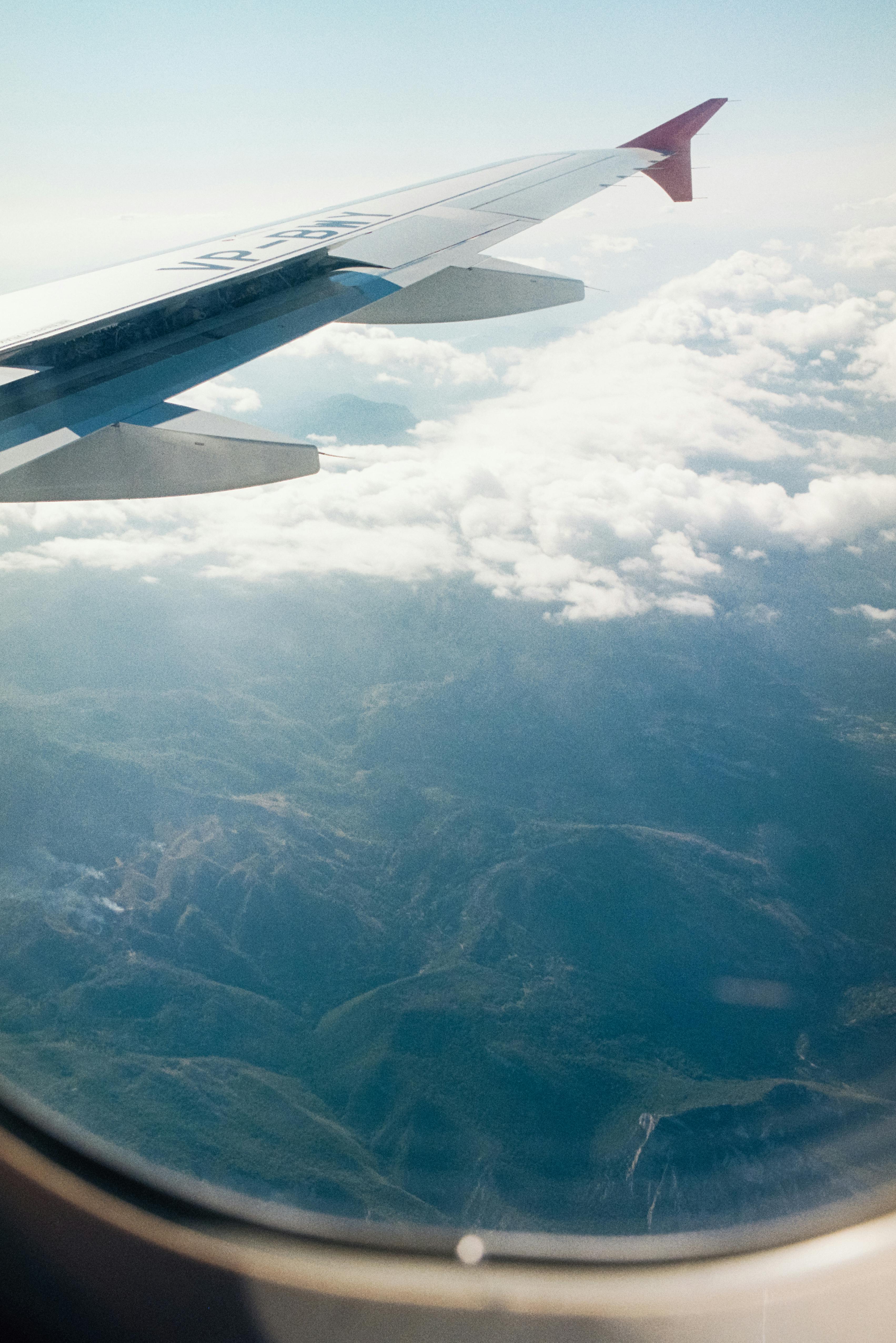 Airplane Wing over Mountains · Free Stock Photo