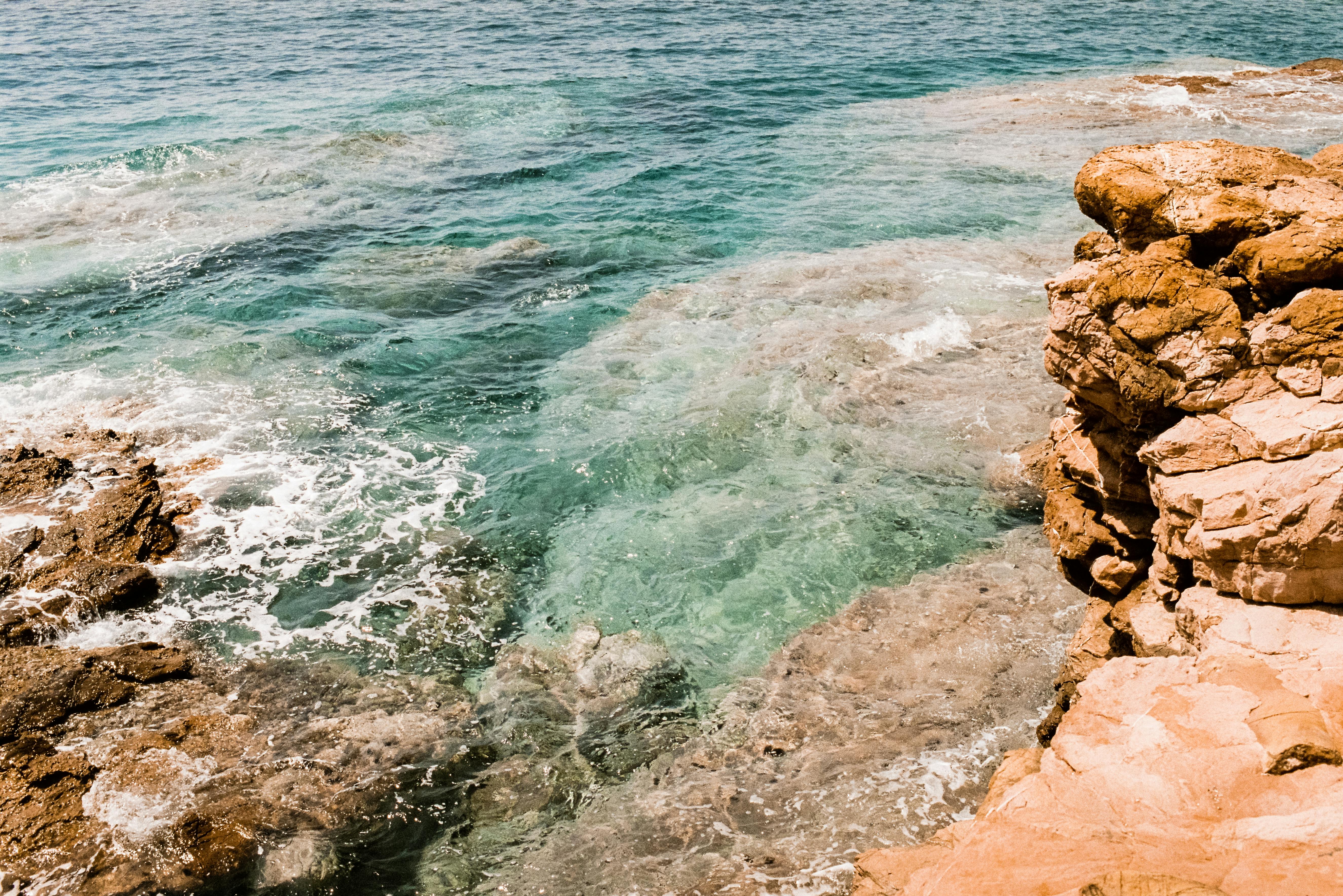 Rocks Forming Arch on Beach · Free Stock Photo