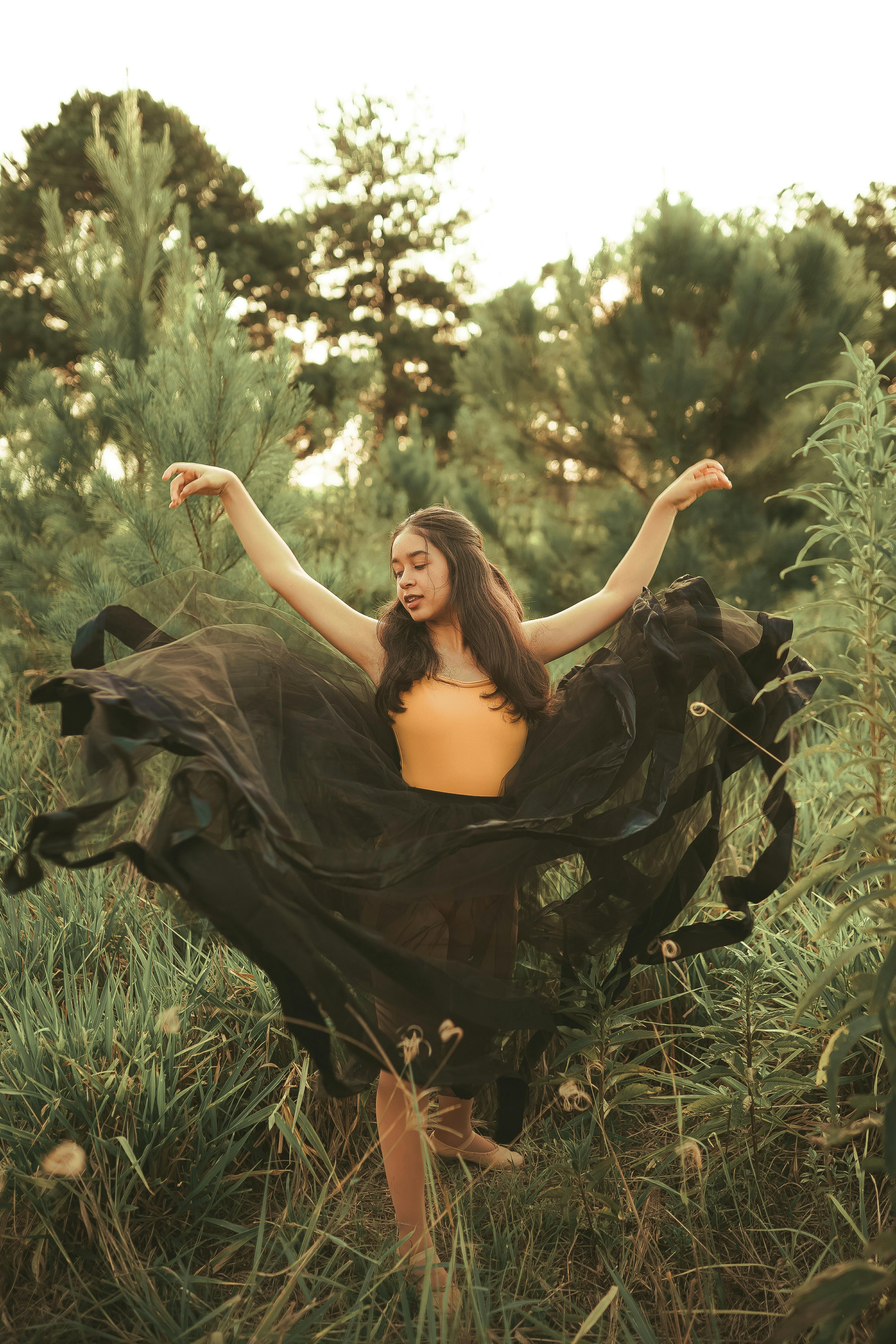 Women Contemporary Dancing on a Grass Field · Free Stock Photo
