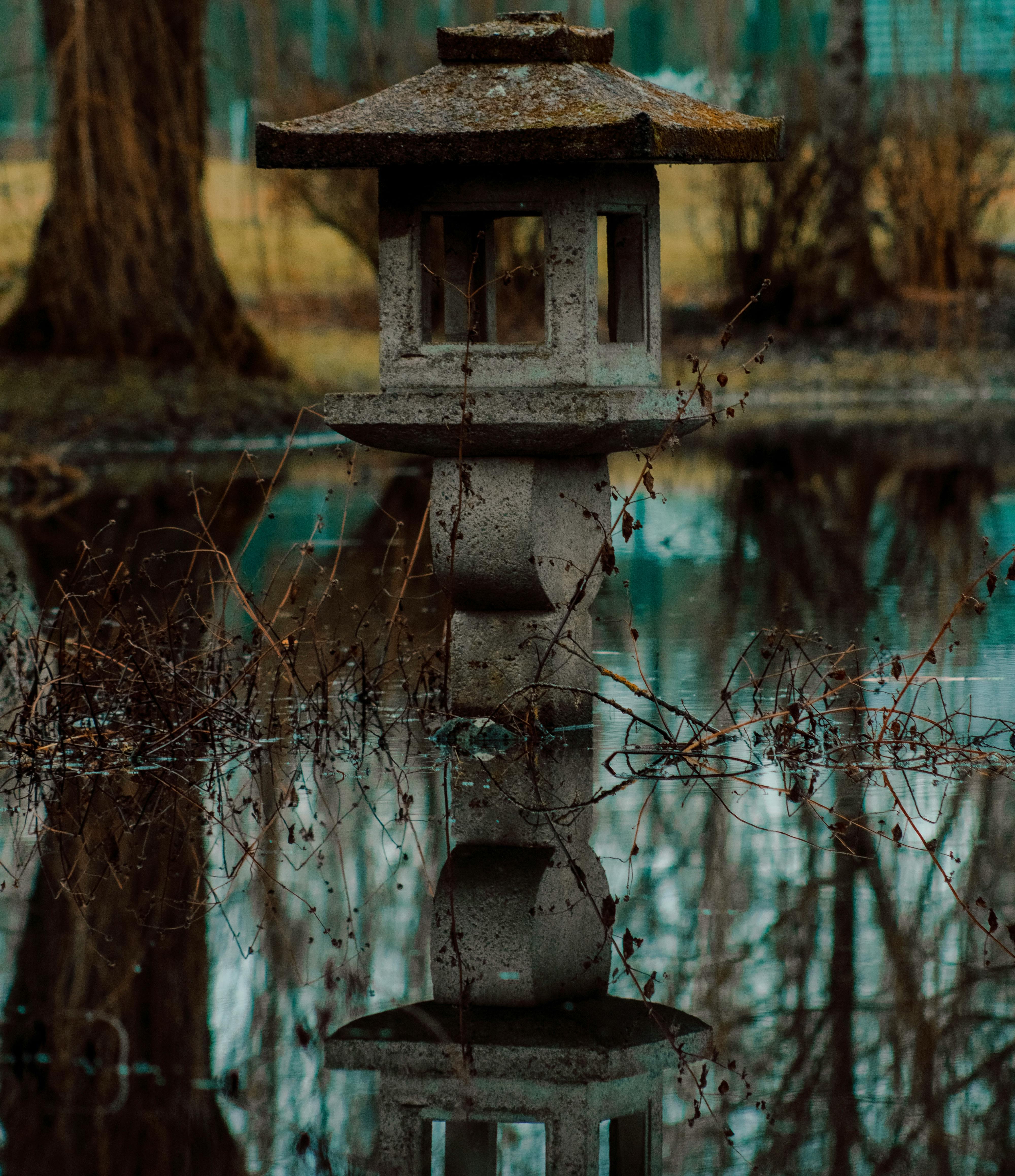 Reflection of Stone Installation in Water · Free Stock Photo