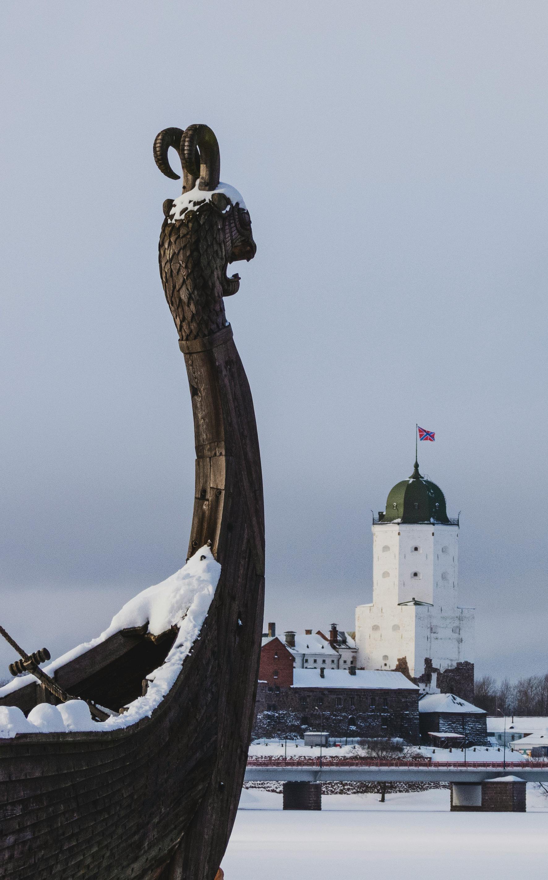 Viking Longboat and Lighthouse behind · Free Stock Photo