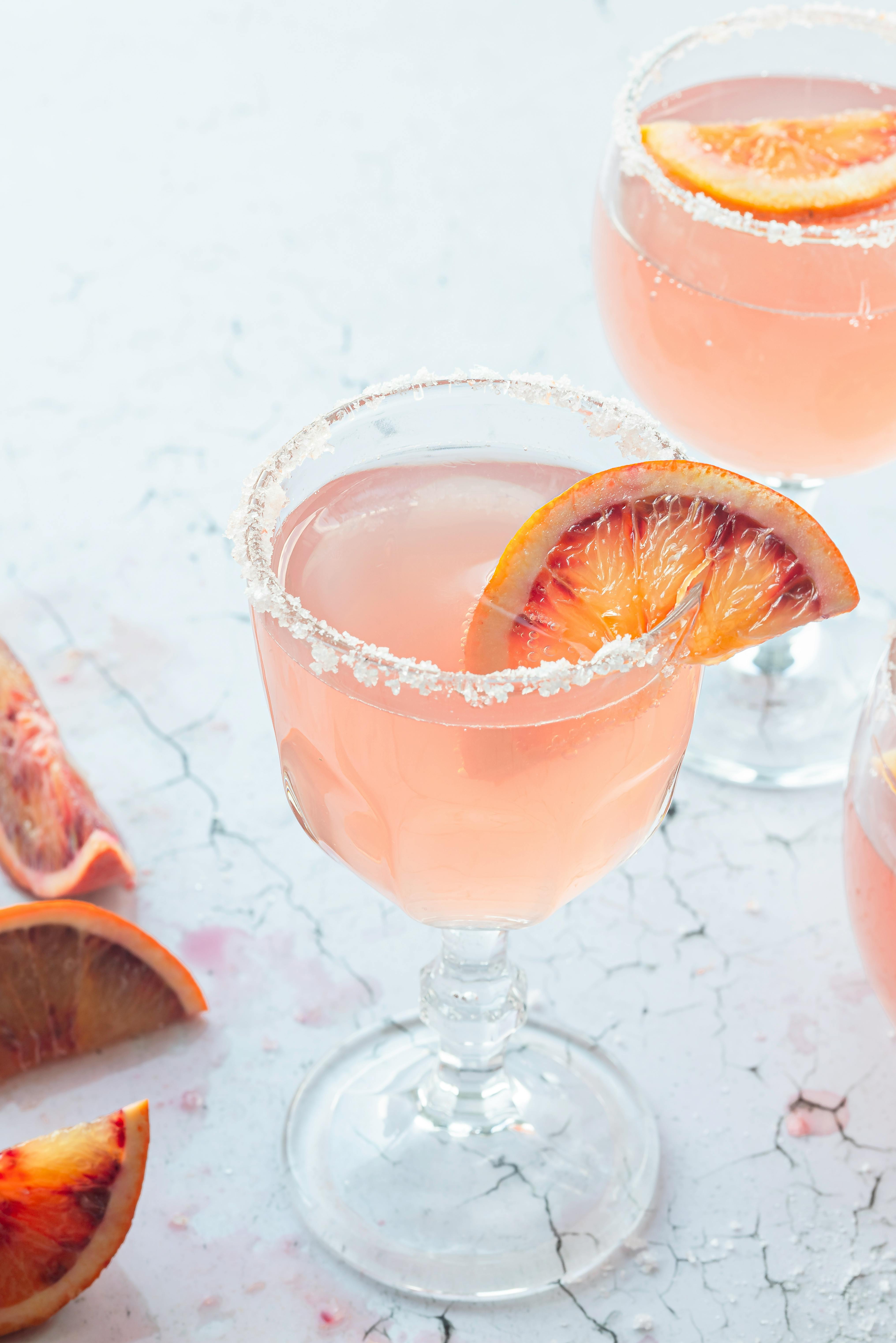 Pink Cocktail Drinks with Slices of Red Orange · Free Stock Photo