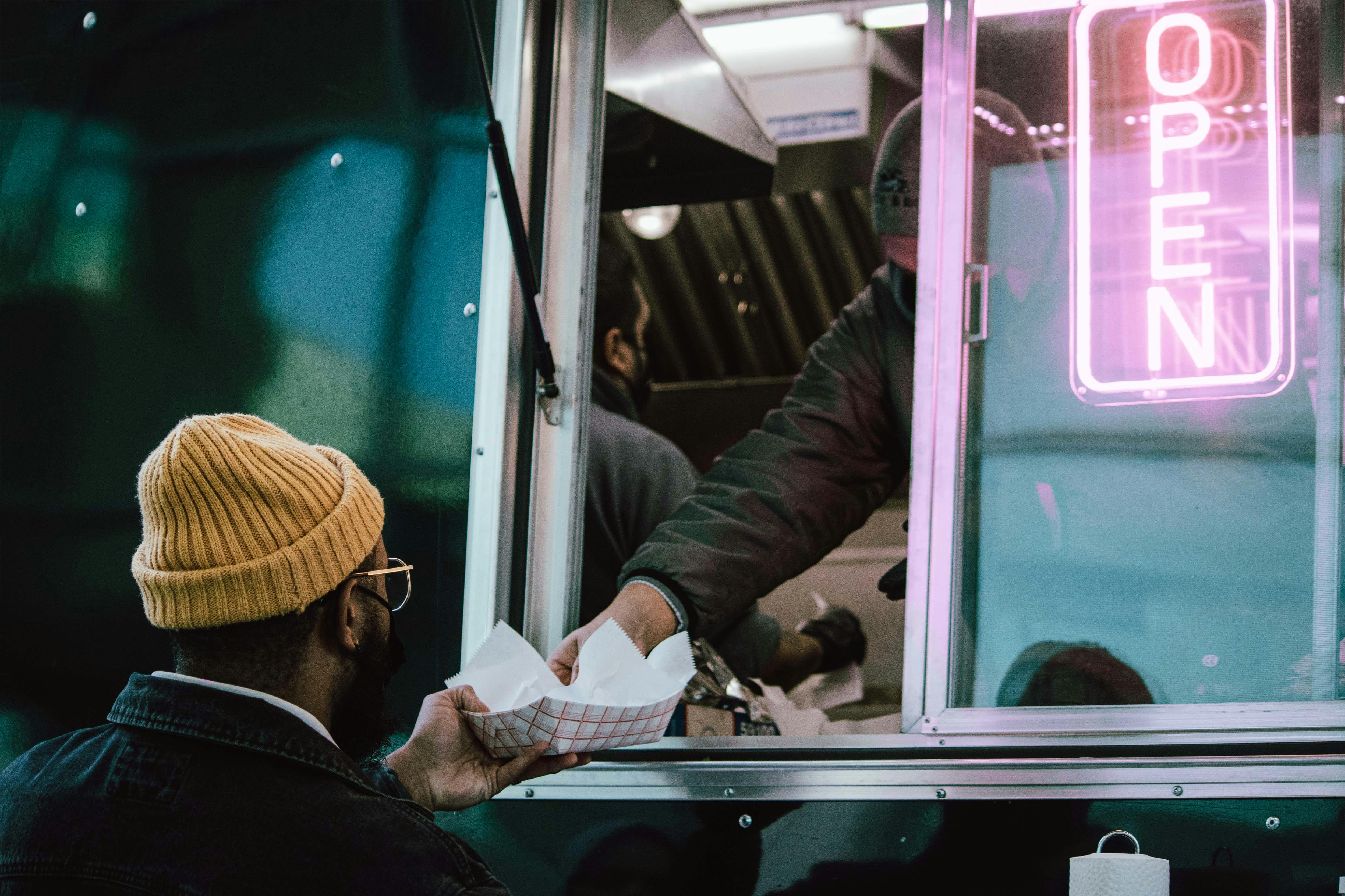 A Customer Receiving His Order · Free Stock Photo