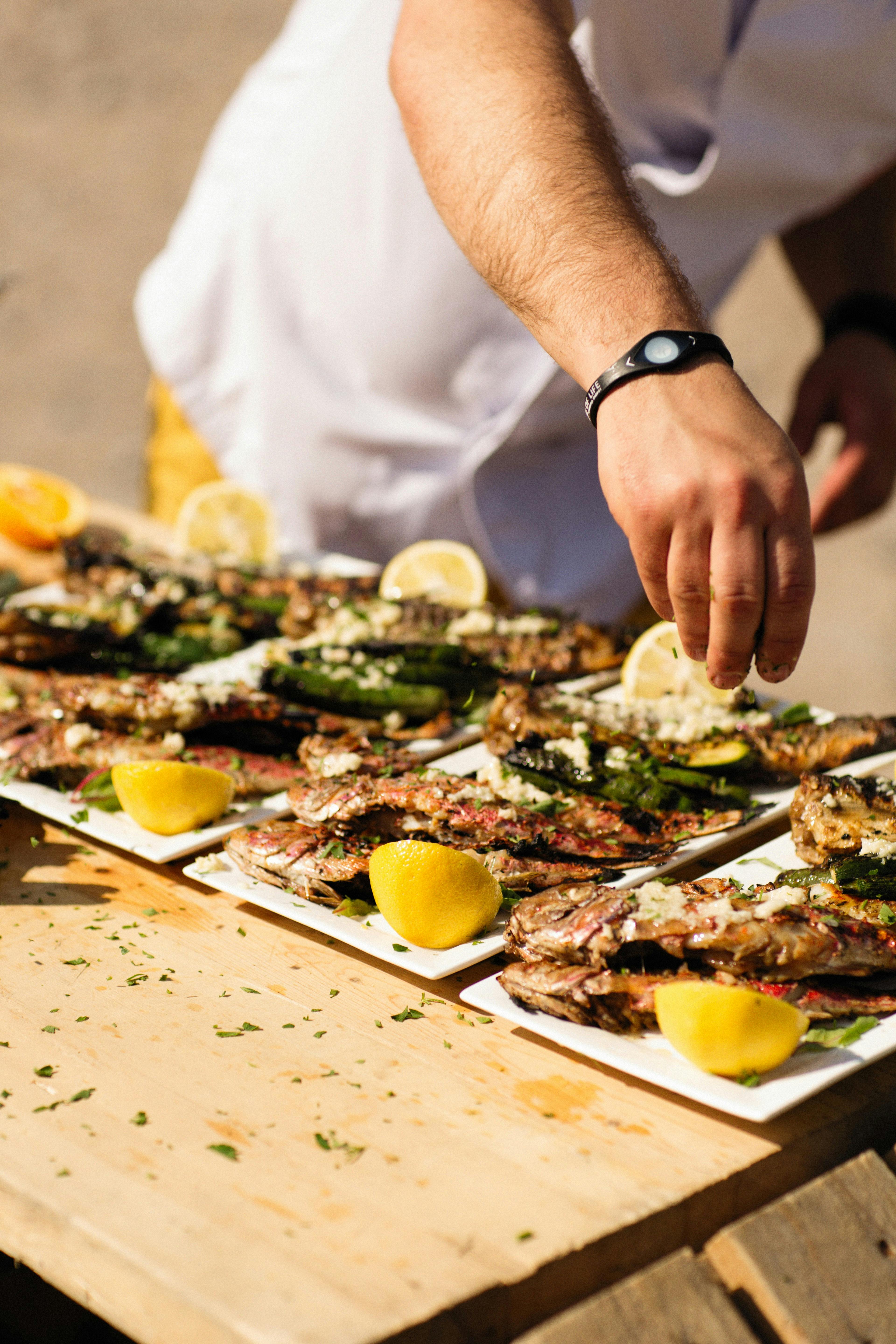 Chef Preparing Fish Dishes · Free Stock Photo