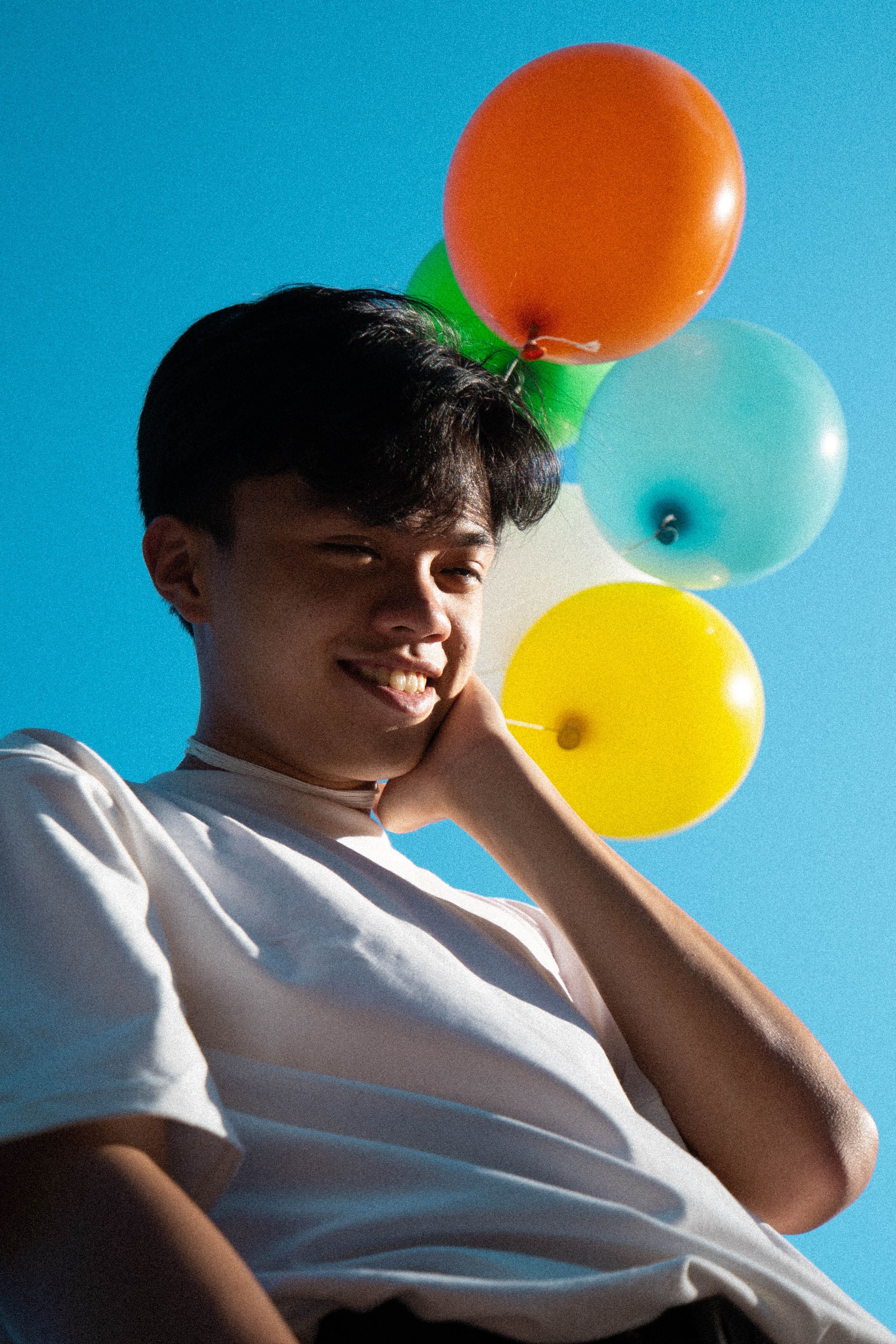 A Man in White Shirt with Balloons String Tied on His Neck · Free Stock ...