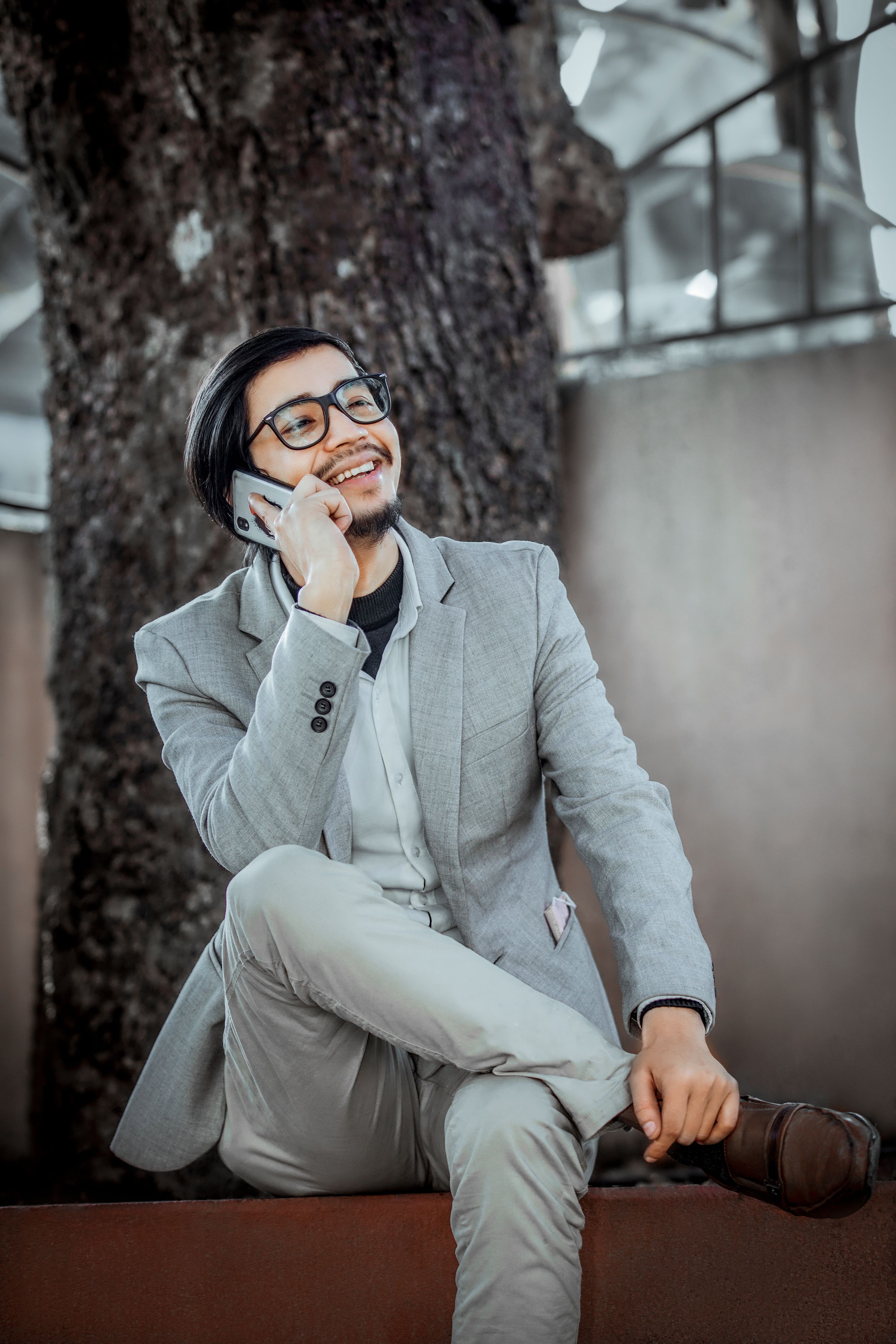 A Man Wearing Suit Jacket Talking on the Phone · Free Stock Photo