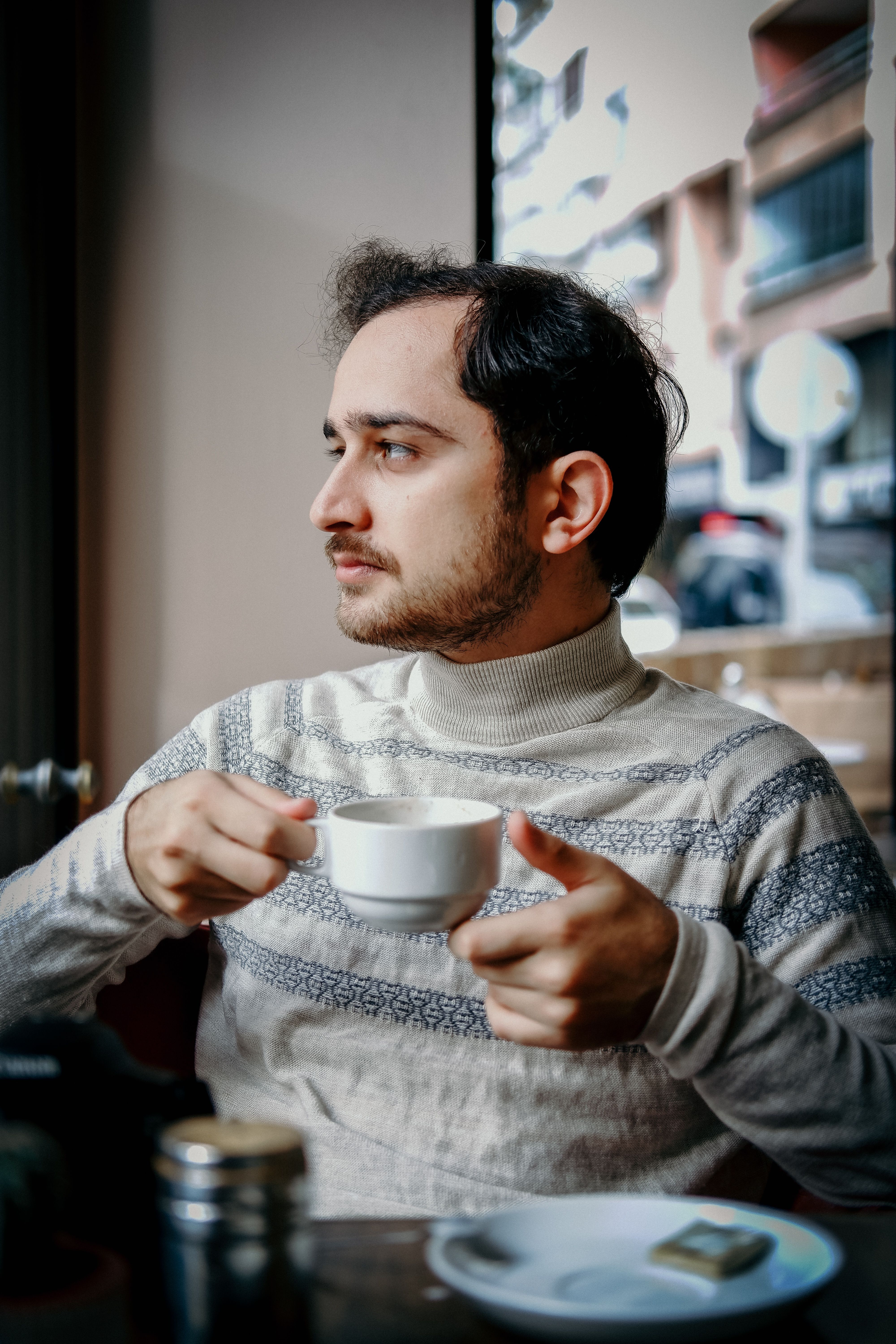 Man Sitting in a Cafe · Free Stock Photo