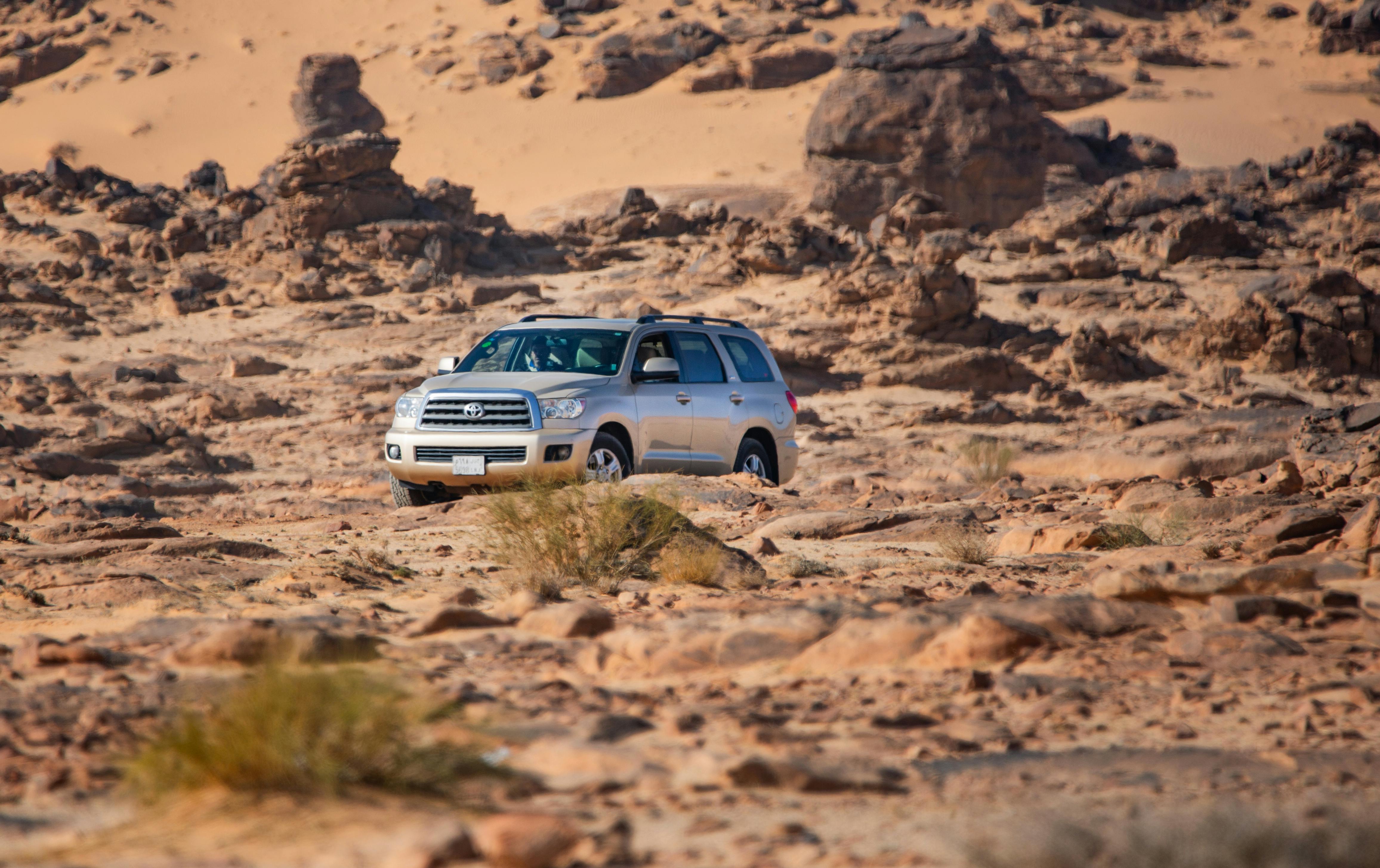 Red 4x4 Car Driving Through Extreme Terrain · Free Stock Photo
