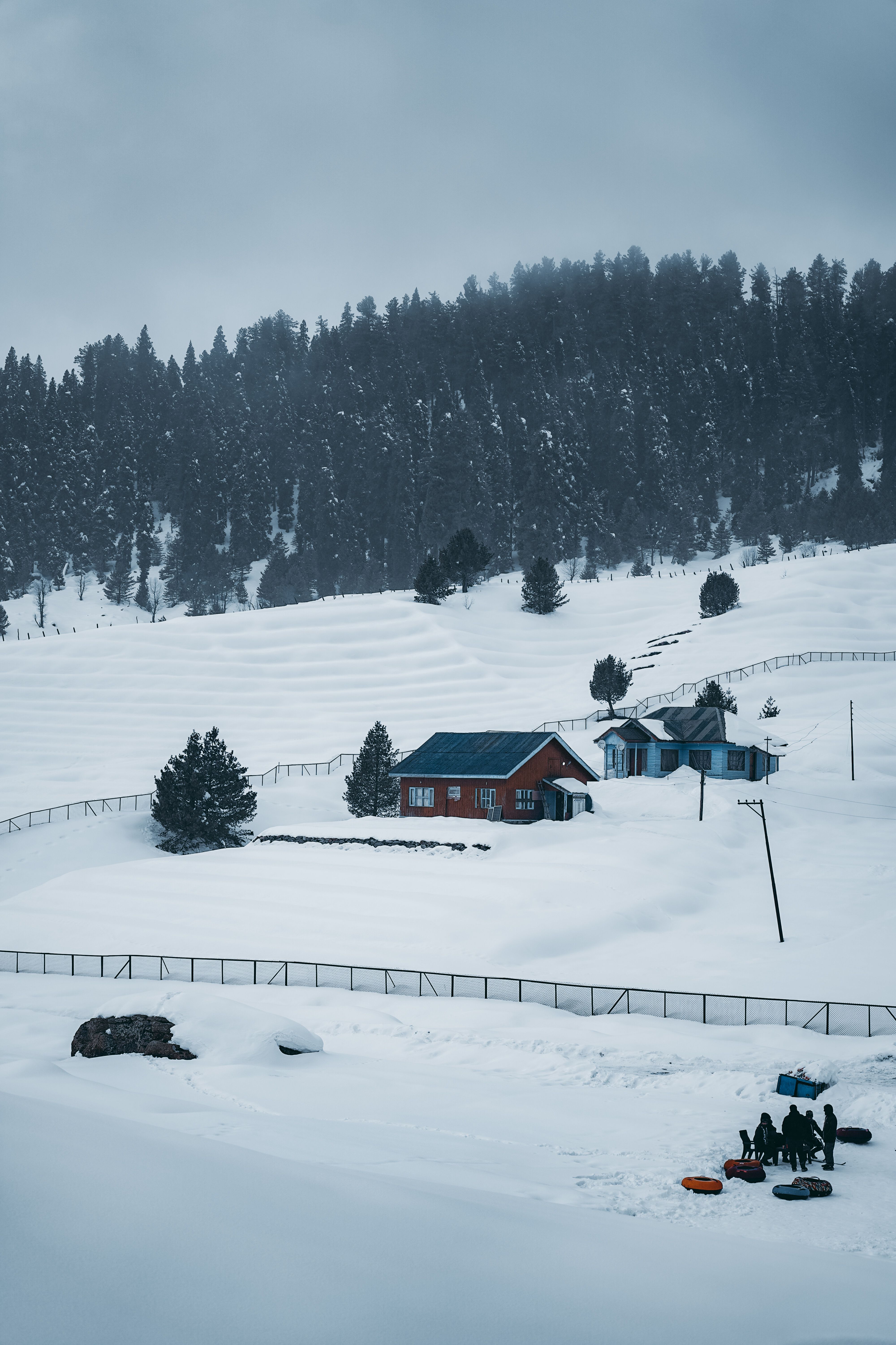 People Gathering Outside Rural House in Winter · Free Stock Photo