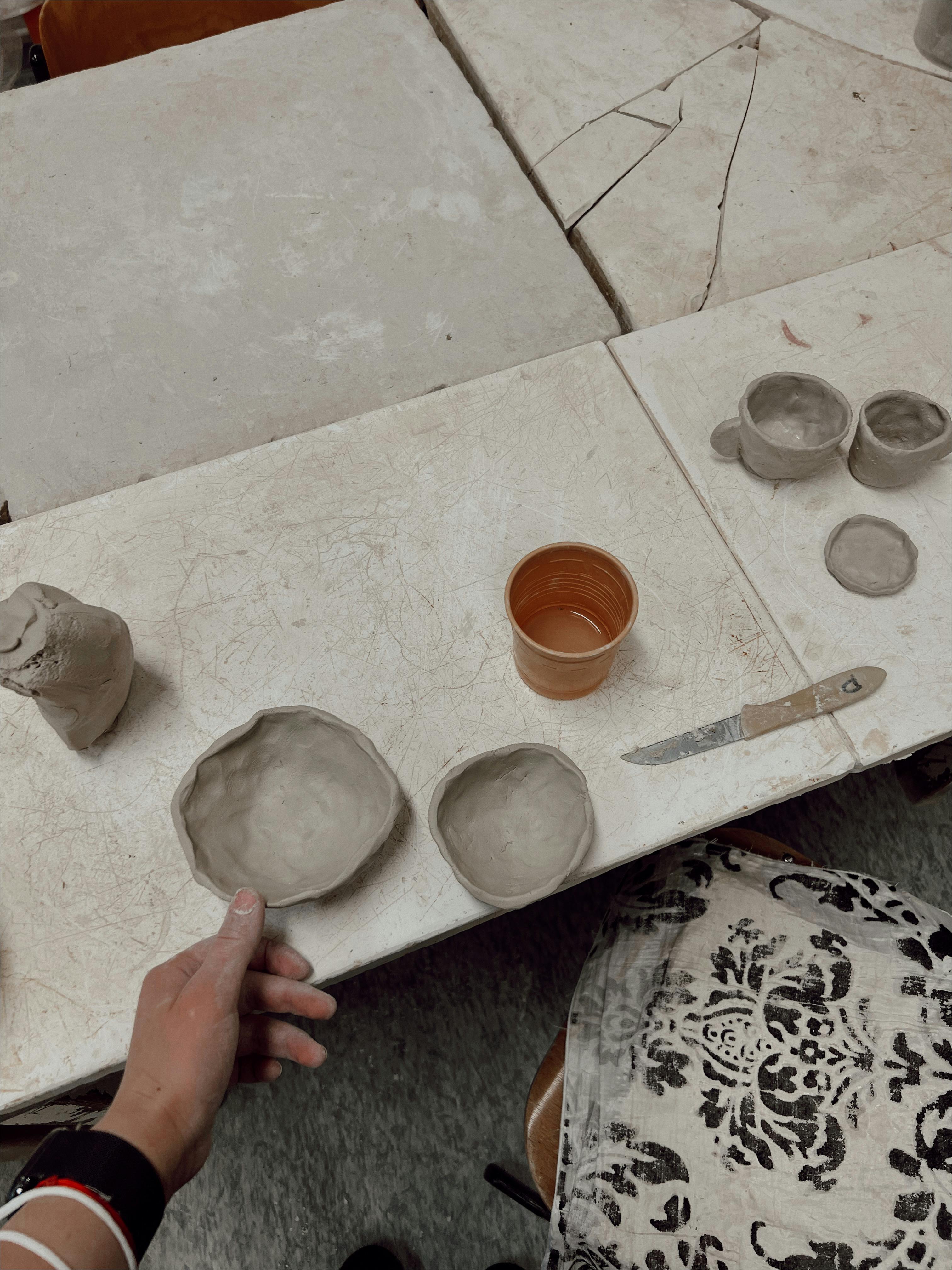 Person Binding Wick to Stick · Free Stock Photo