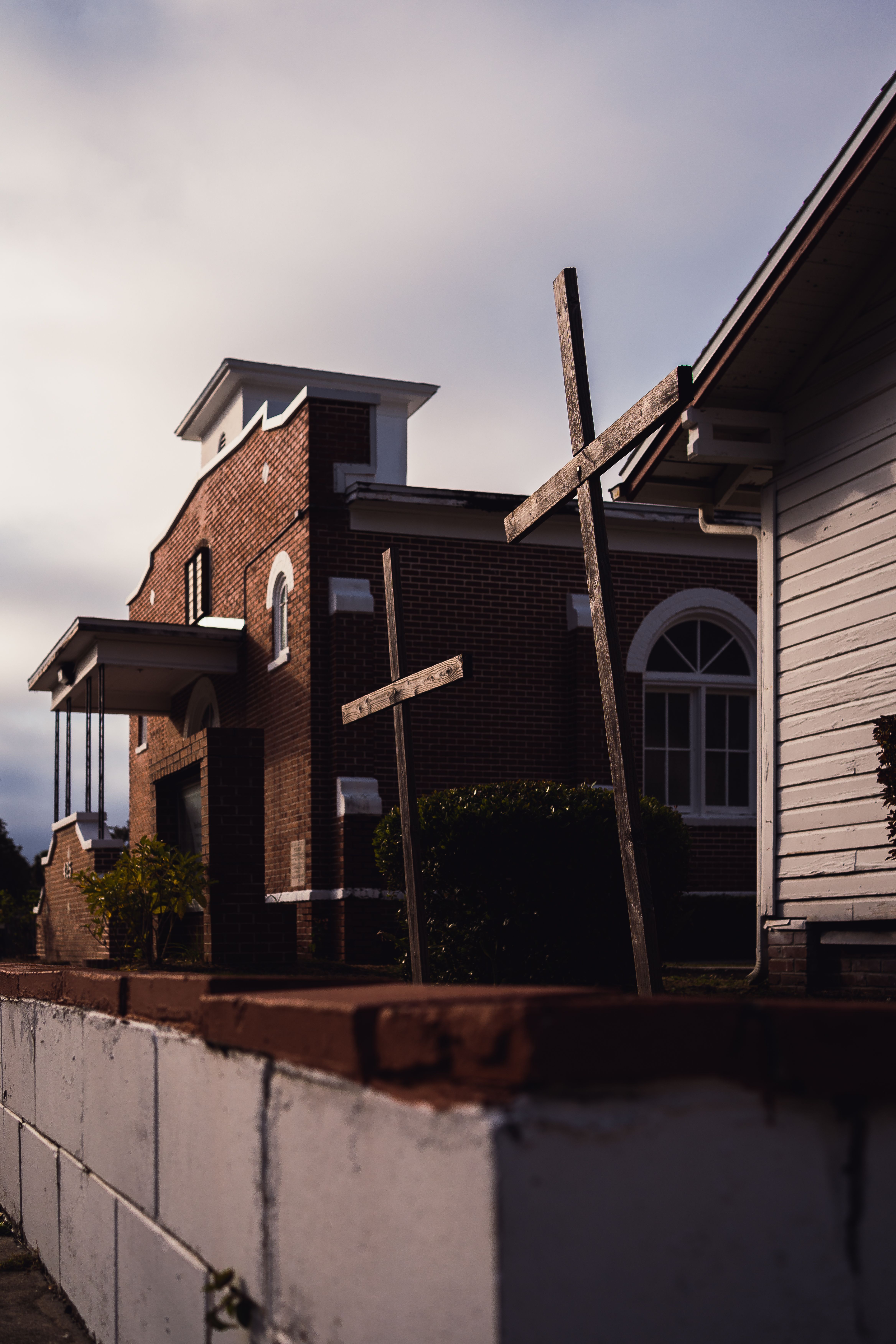 Two Wooden Crosses in front of a House · Free Stock Photo