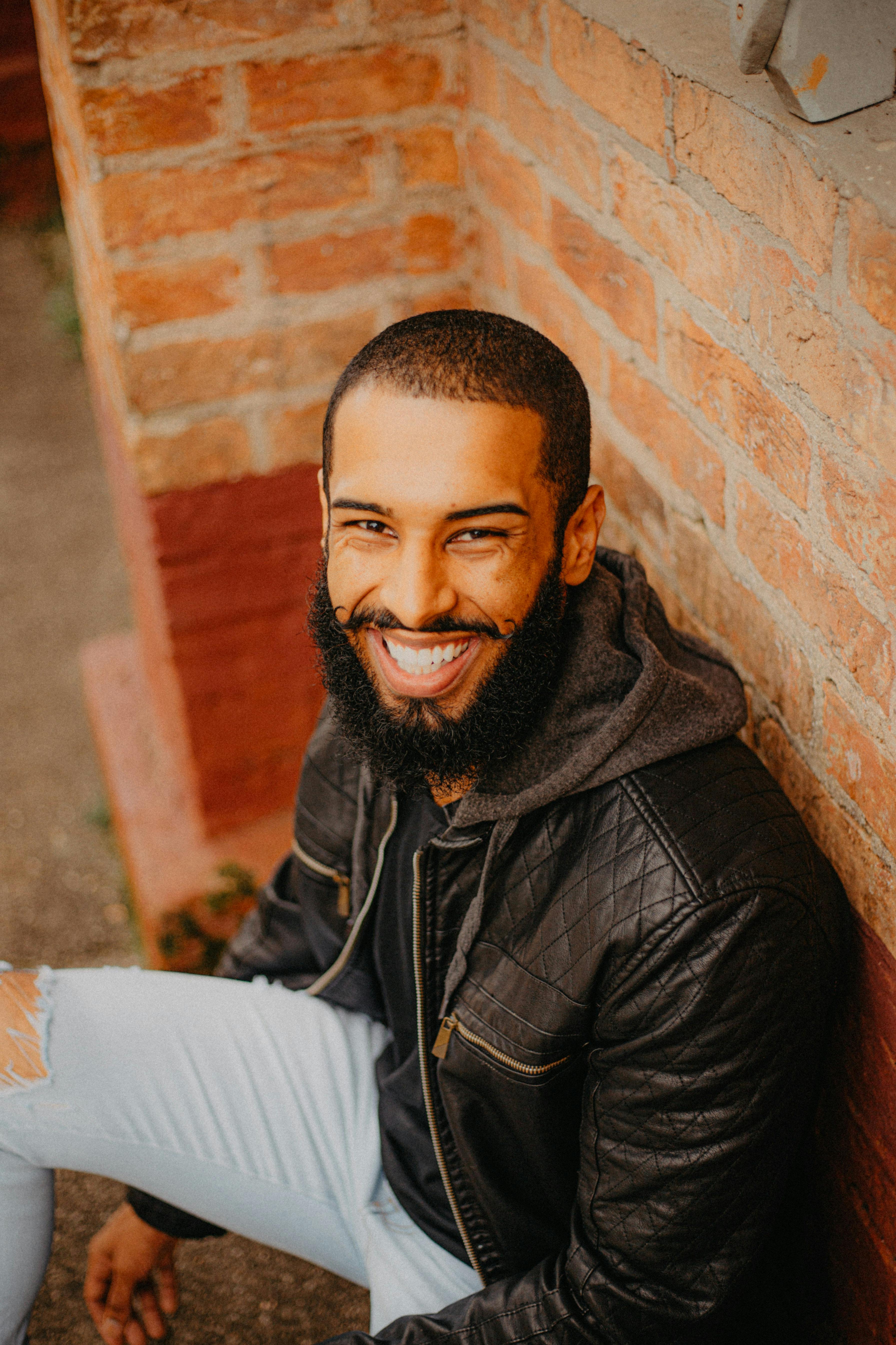 Smiling Fisherman Sitting in Boat · Free Stock Photo