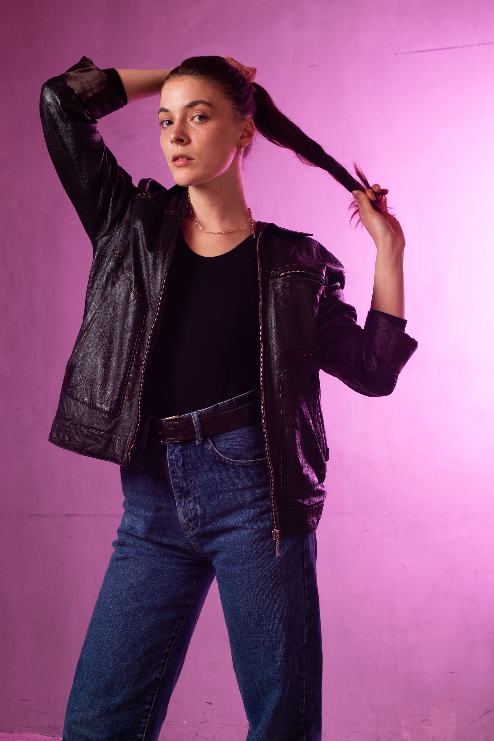 Woman Wearing a Denim Jacket with Hands on Head · Free Stock Photo