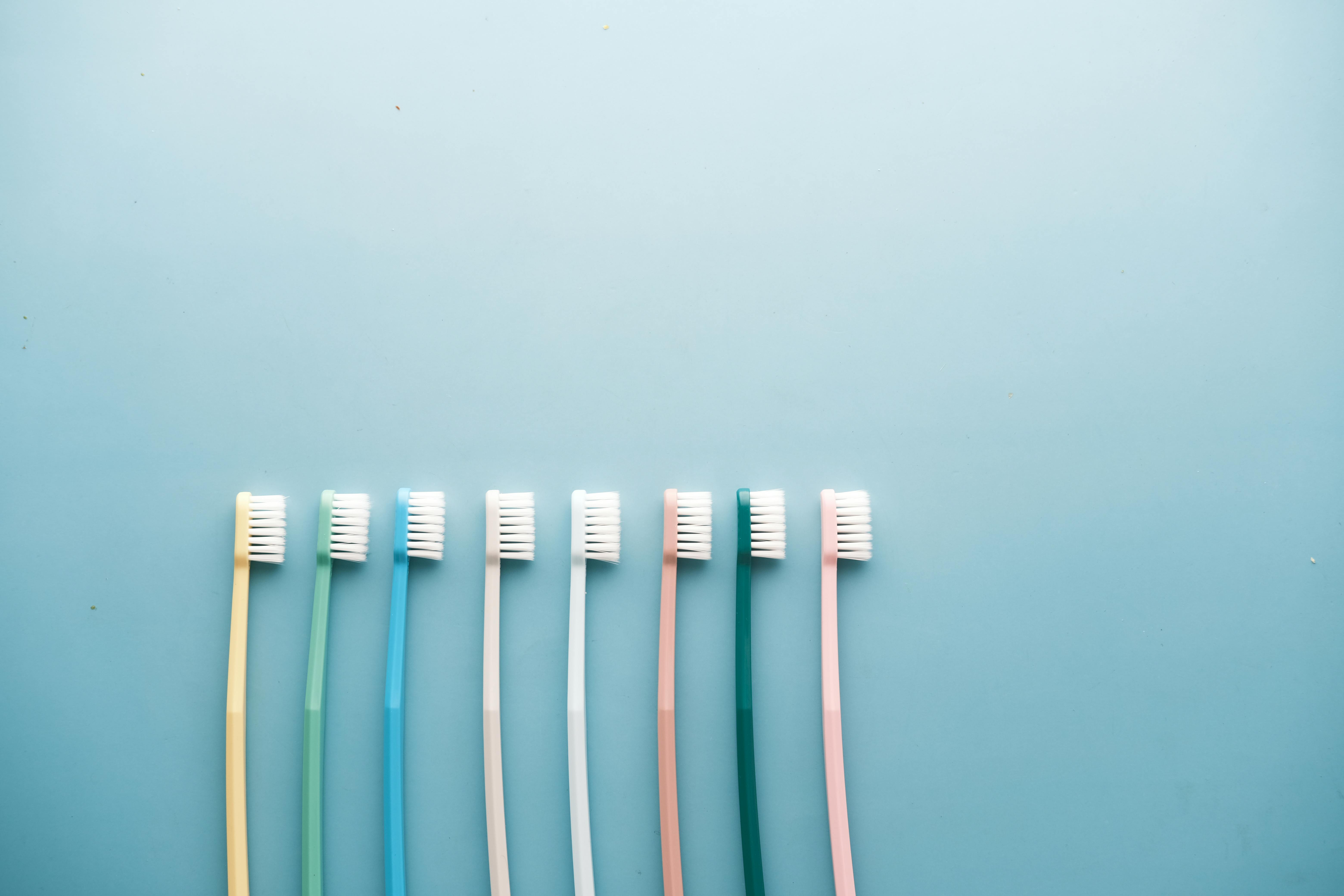 Toothbrushes in Various Colors · Free Stock Photo