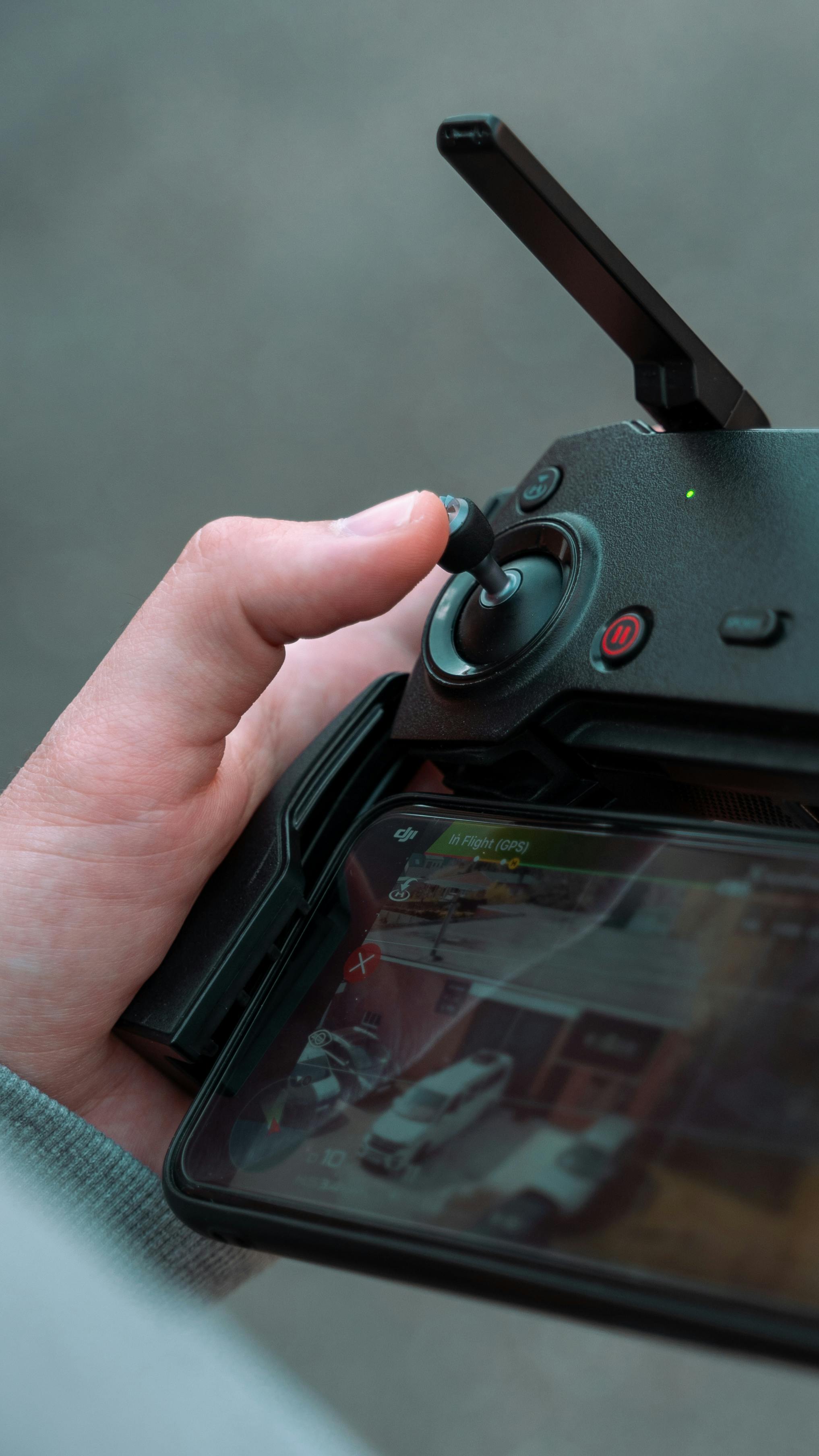 Person Holding Black Remote Control · Free Stock Photo