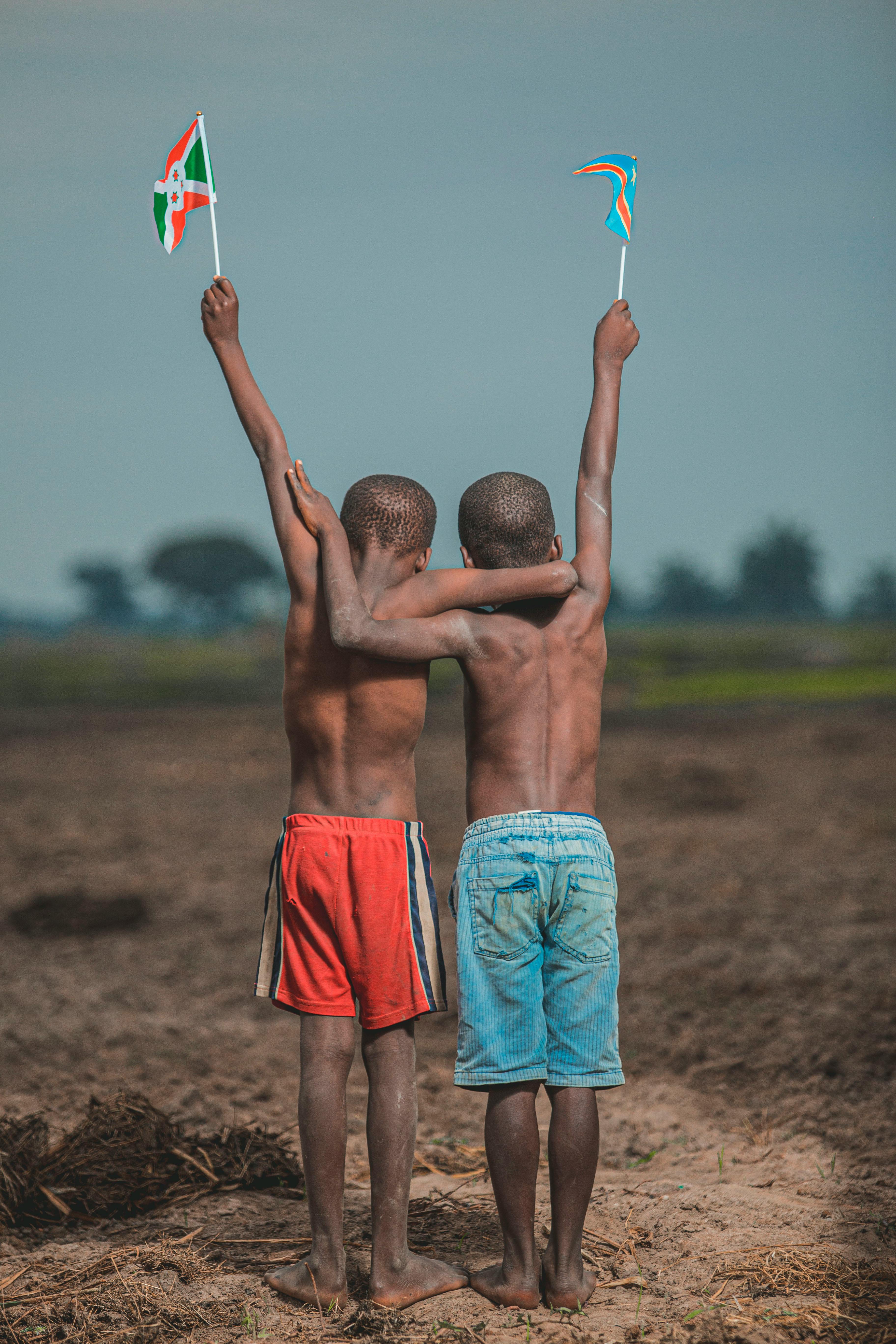 Boys Raising Flags · Free Stock Photo