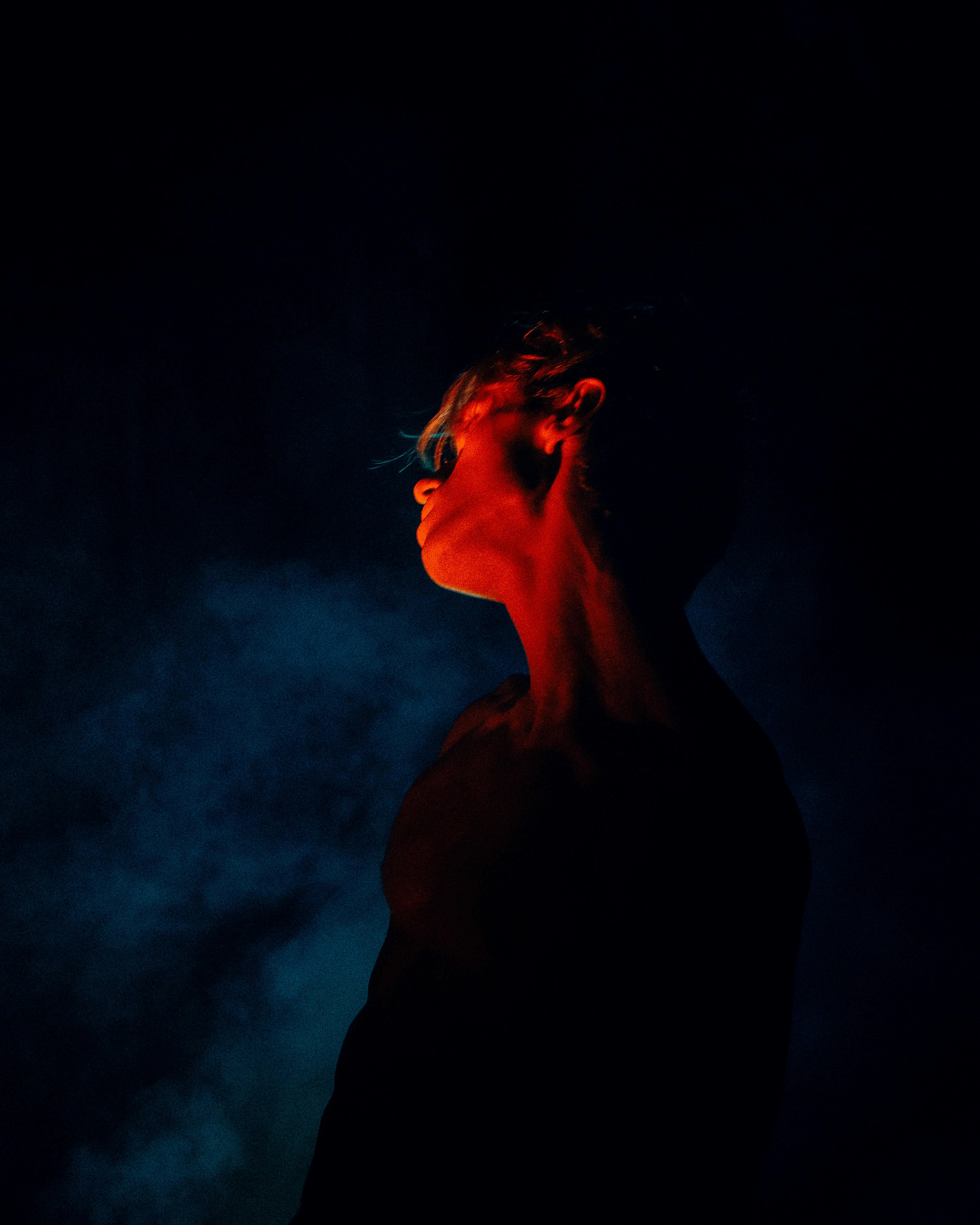 Photo of a Man Illuminated by a Red Light · Free Stock Photo